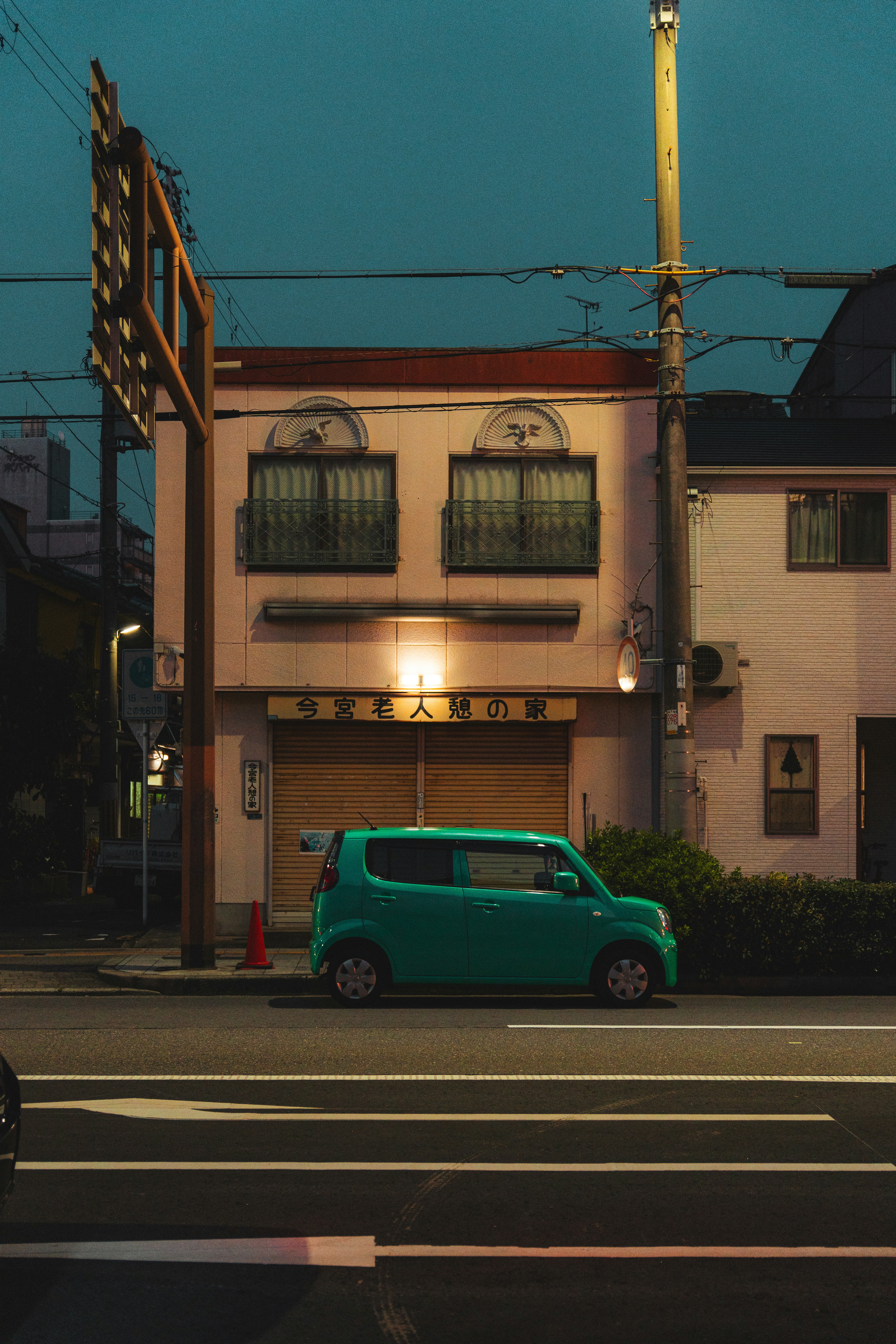 Turquoise Hatchback in a Quiet Urban Street
