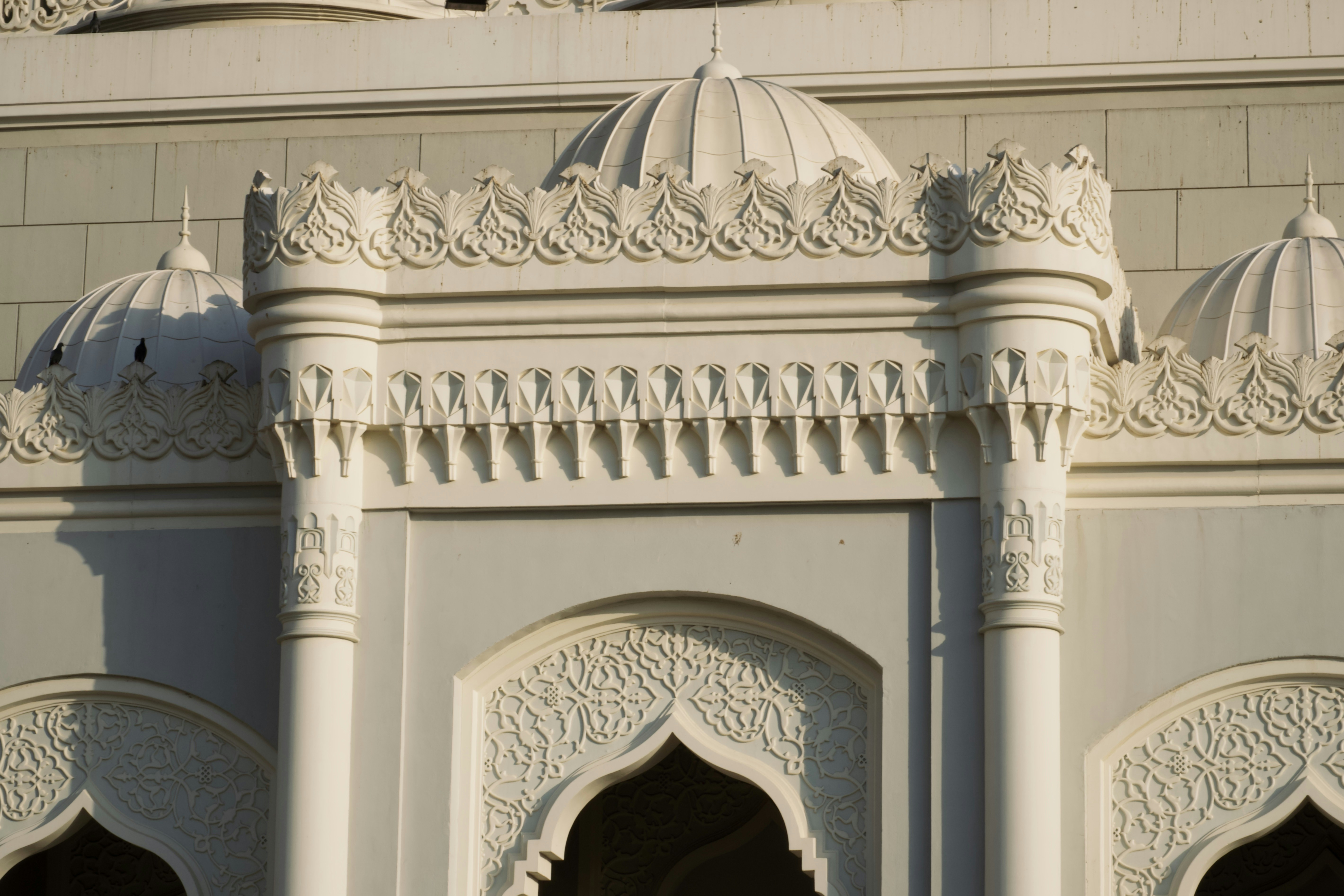 Carved Frieze of a Sacred Facade: A Play of Arches and Domes