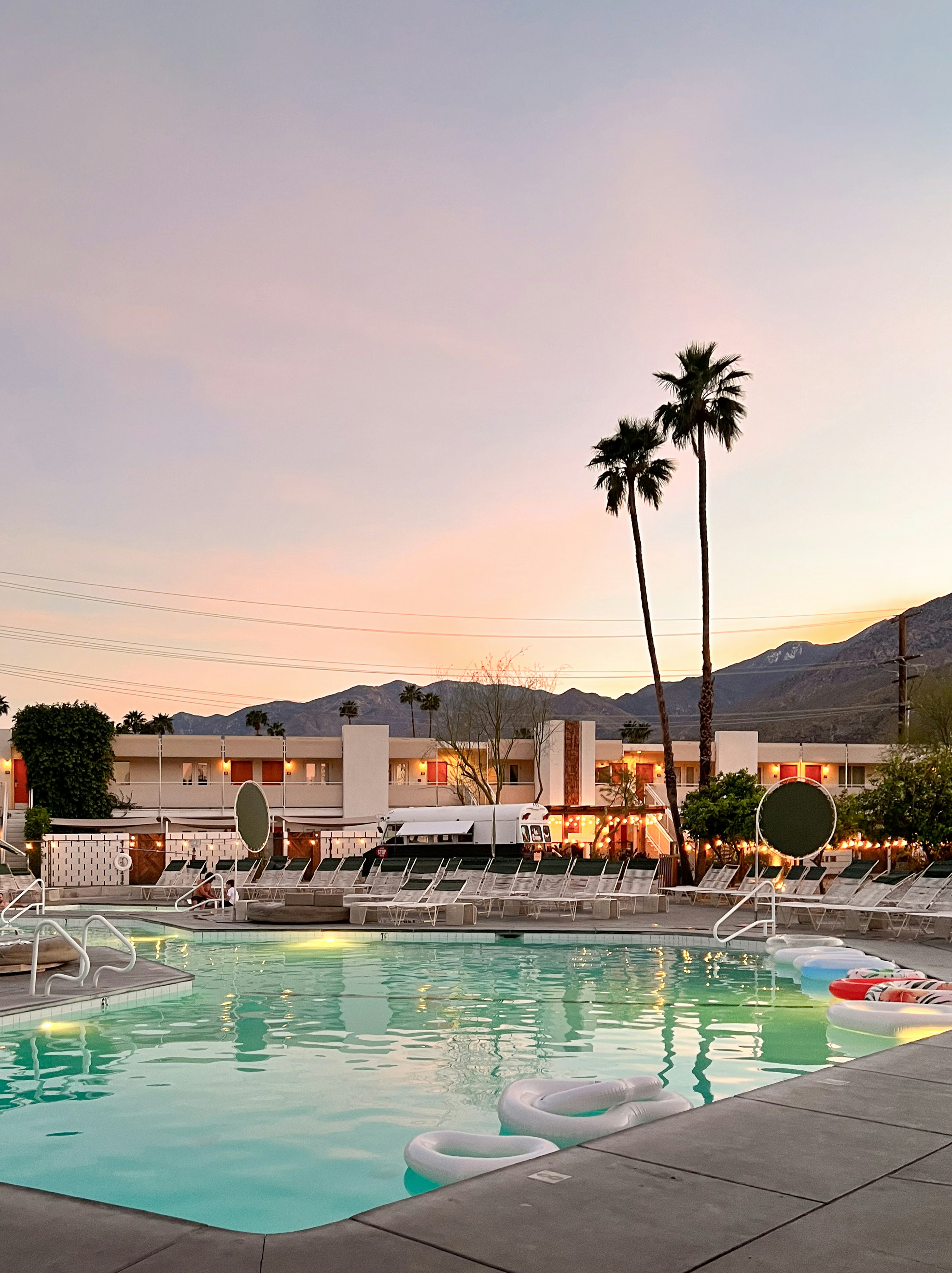 Twilight Oasis: Poolside Lounge Beneath Crescent Palms