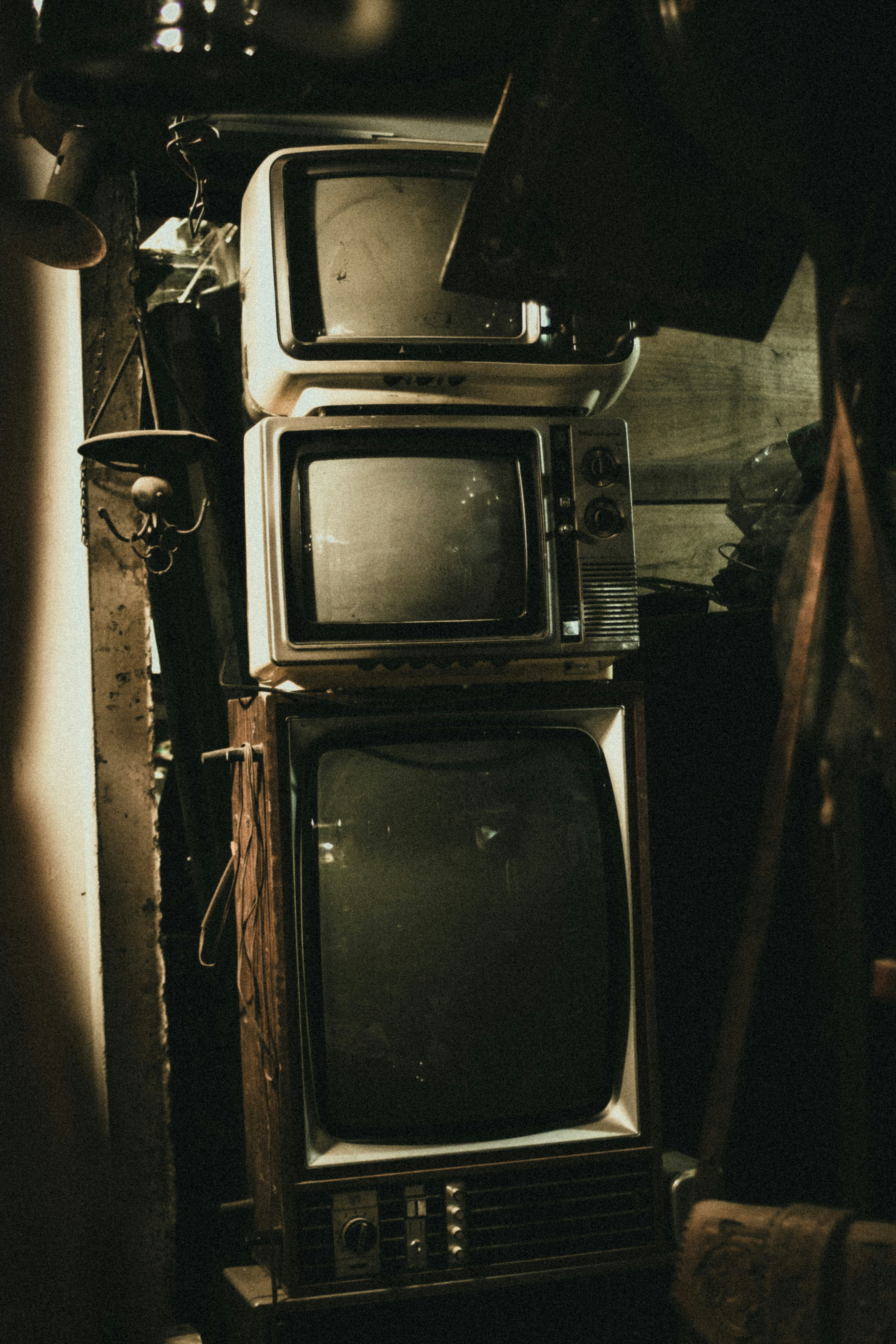 Retro TV Stack in a Dusty Corner