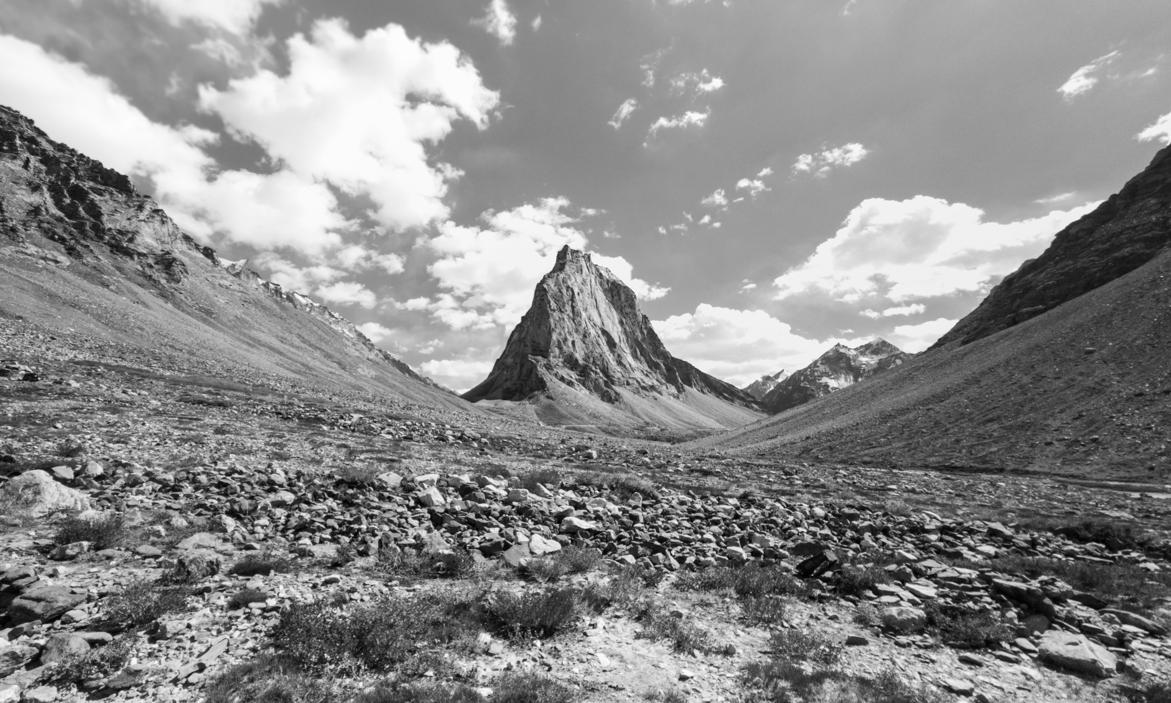 Peak in a Polar Valley: A Lone Spire Reaches Above a Rugged Basin