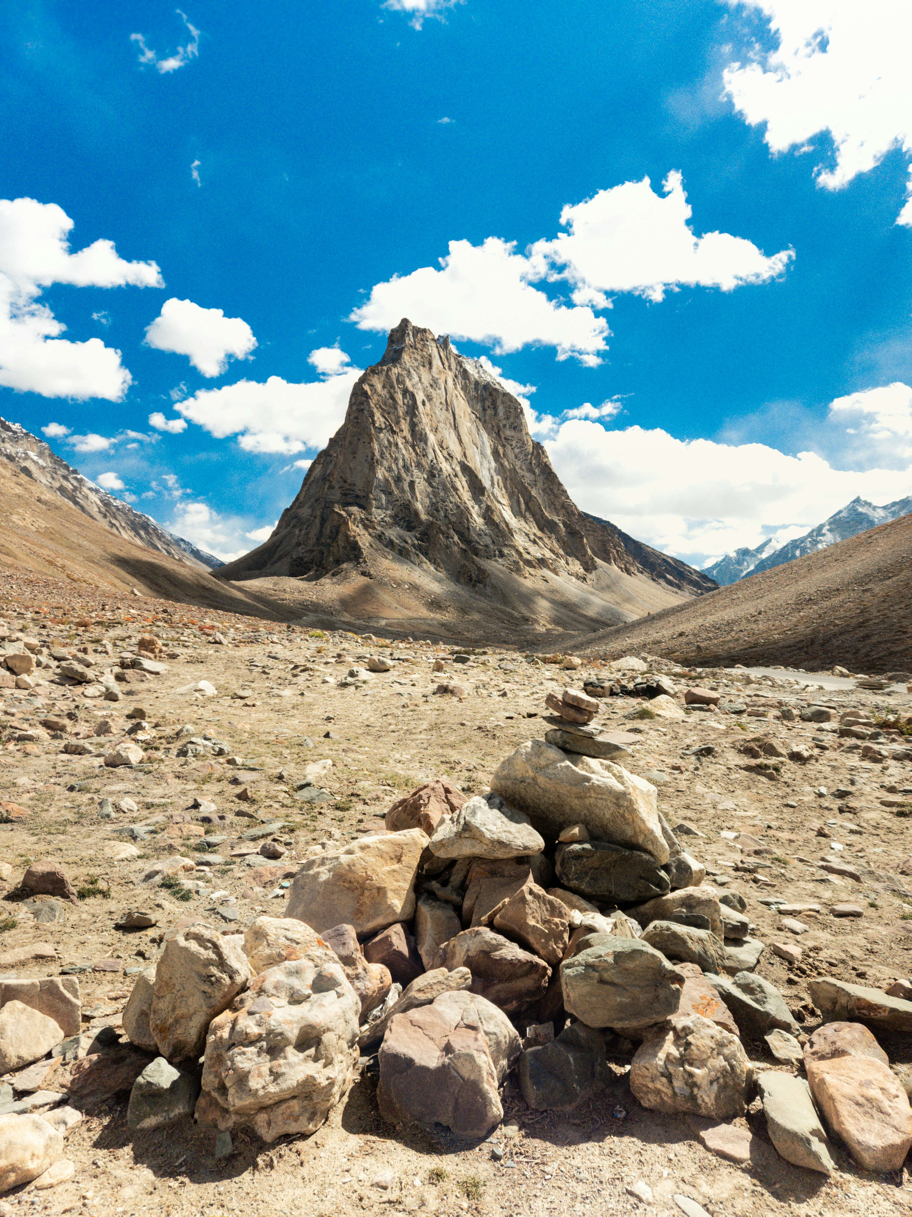 Gonbo Rangjon (also known as Gumbok Rangan) is a majestic, 5,520-meter (18,110 ft) standalone rock monolith in the Lungnak Valley of Zanskar, Ladakh, India. Revered by locals as “God's Mountain,” it is considered the sacred earthly throne of the Buddhist deity Mahakala.