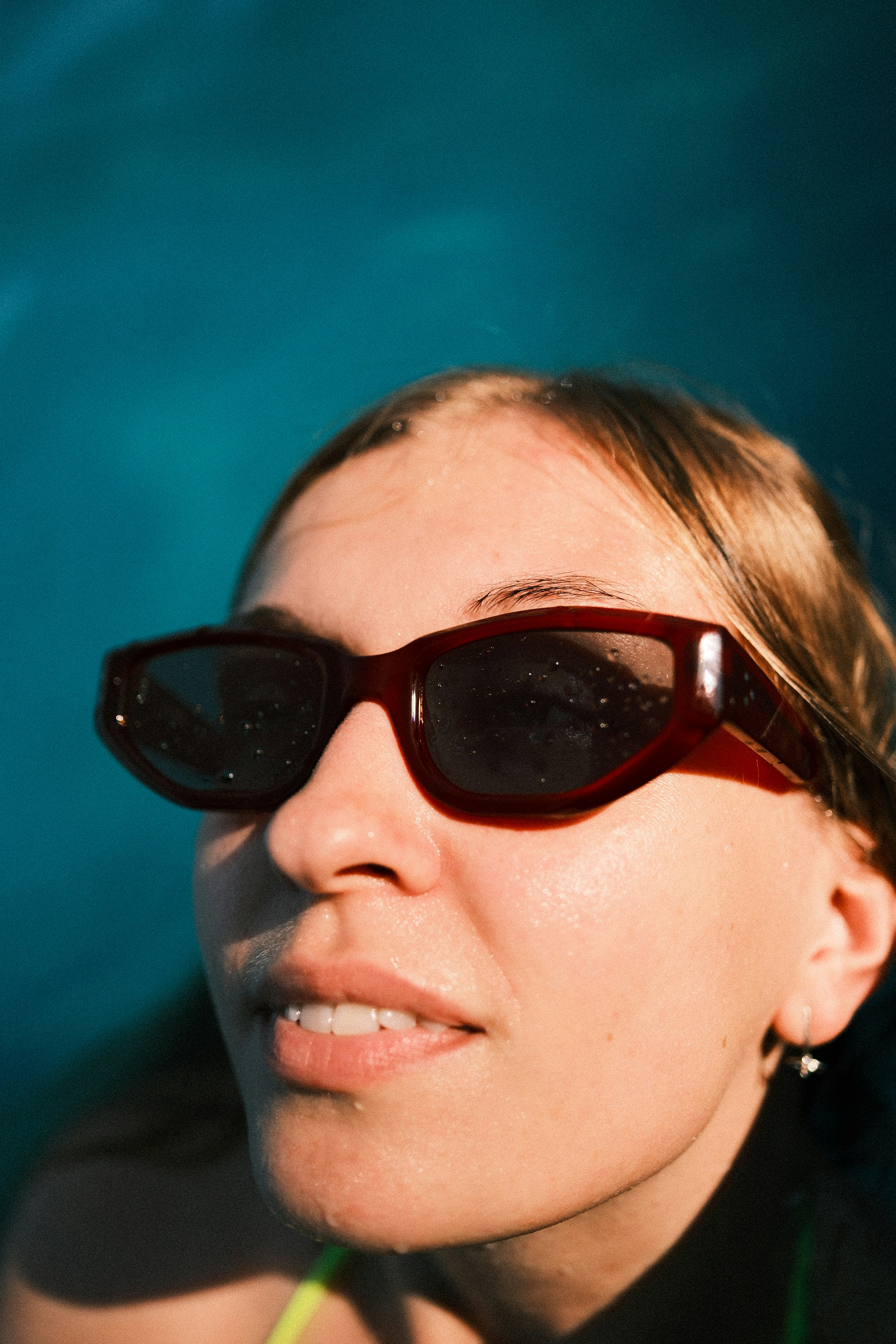 Sunlit Confidence: close-up in swim-ready sunglasses