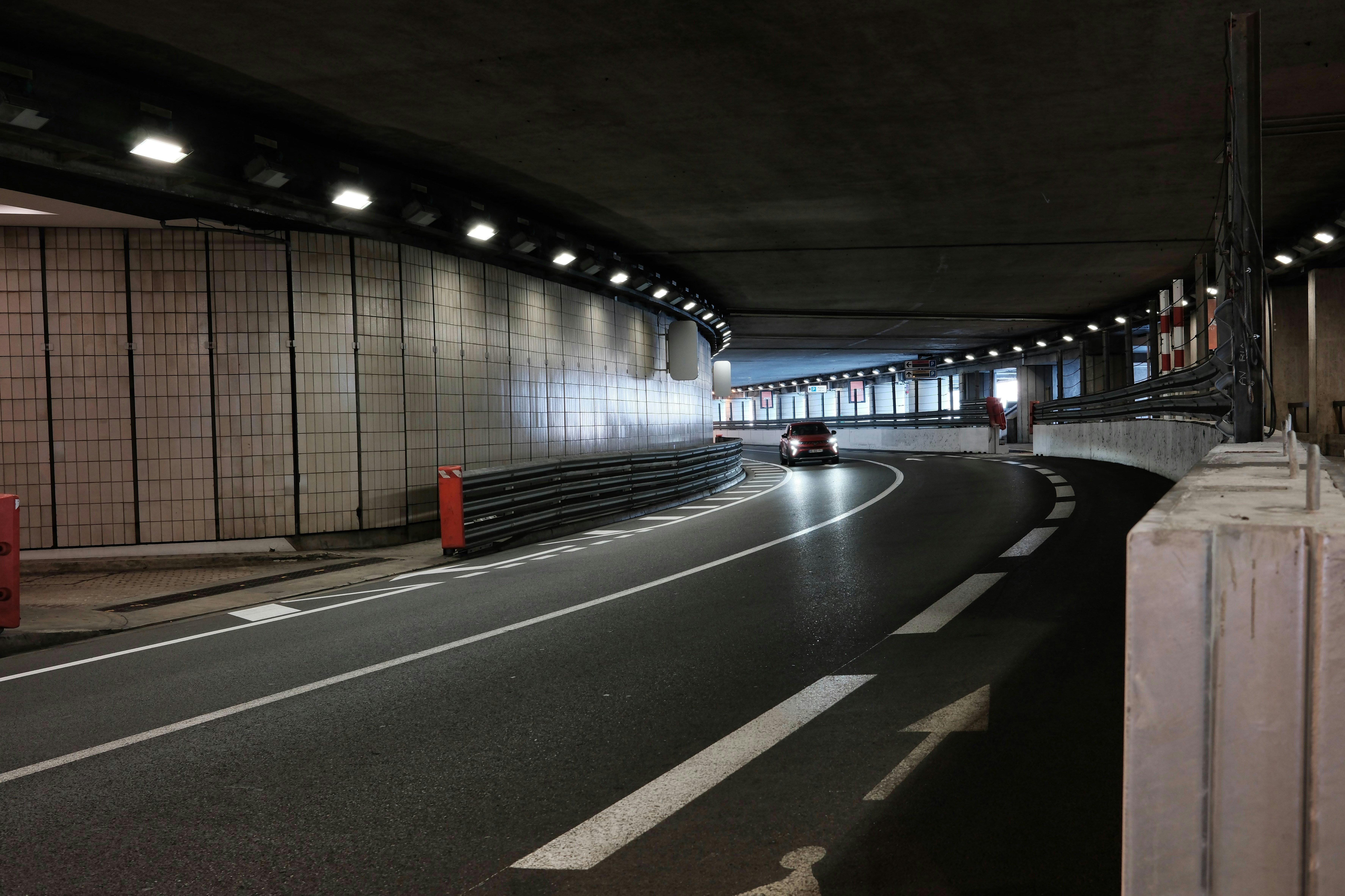 Curved Tunnel Drive: A Quiet Ascent Through Neon-Quiet Walls