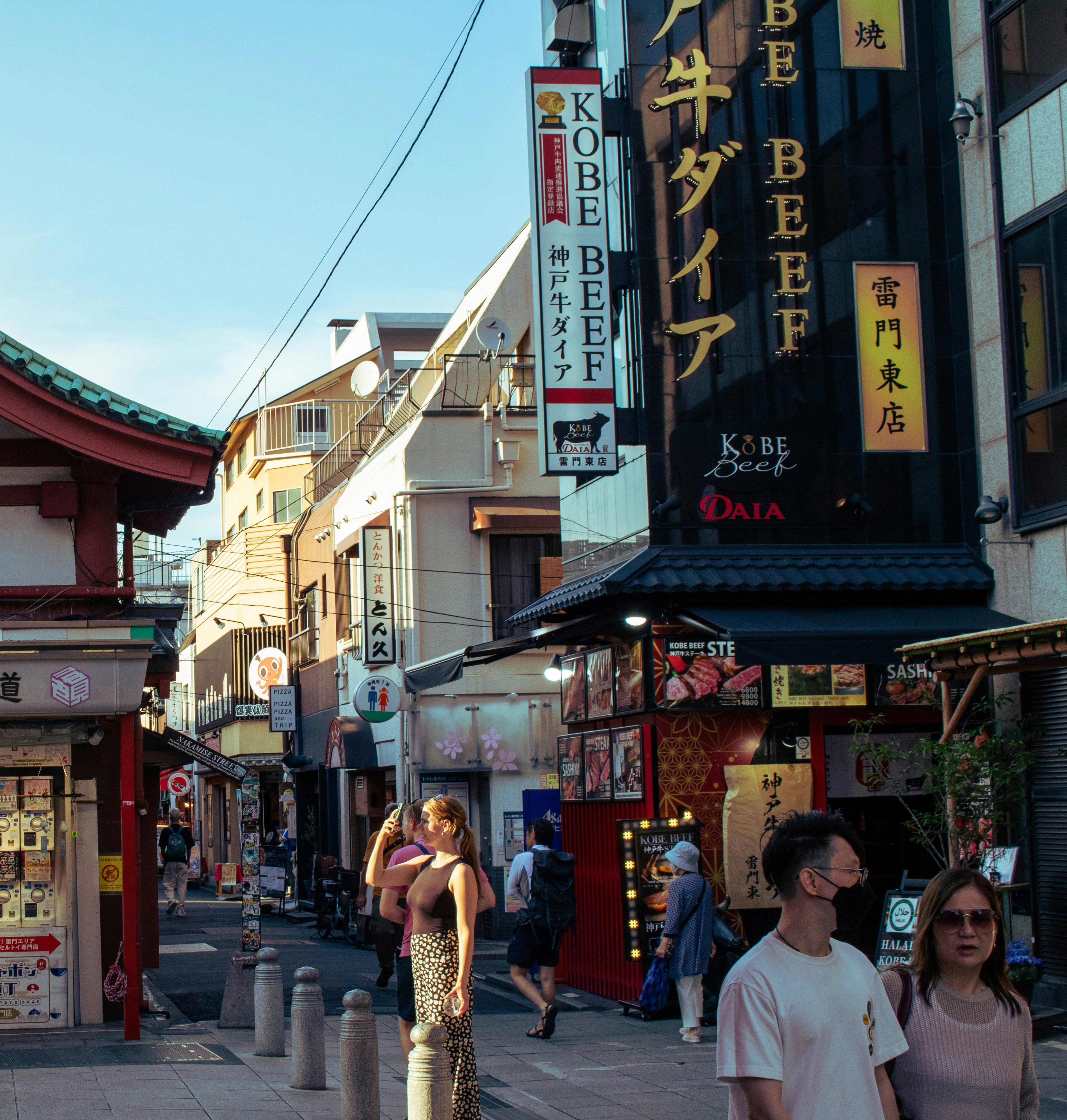 Neon Alleyway: A Sunlit Street in a Bustling Tokyo-Style District