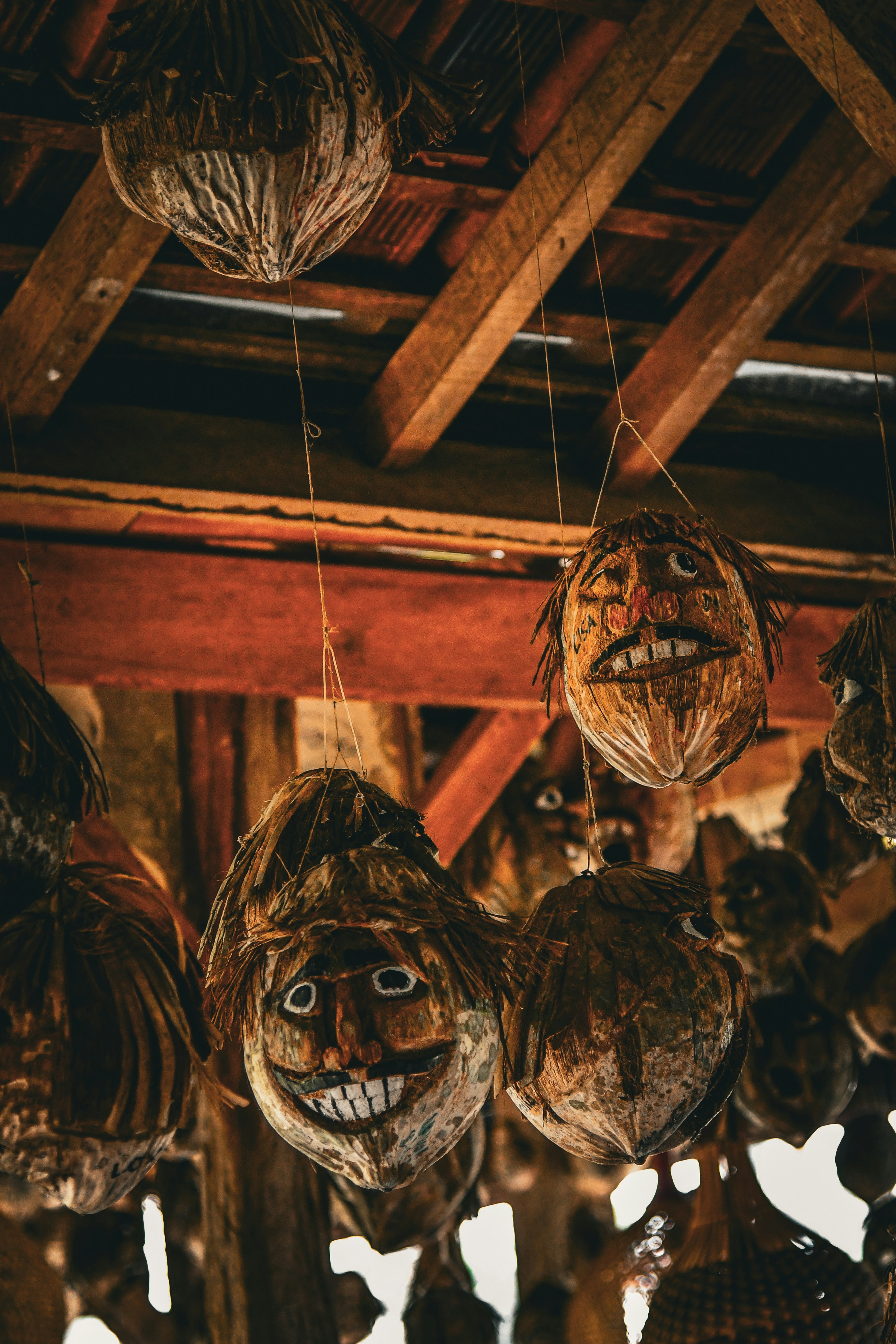 Harvested Faces: Hanging Masks in a Dusty Attic