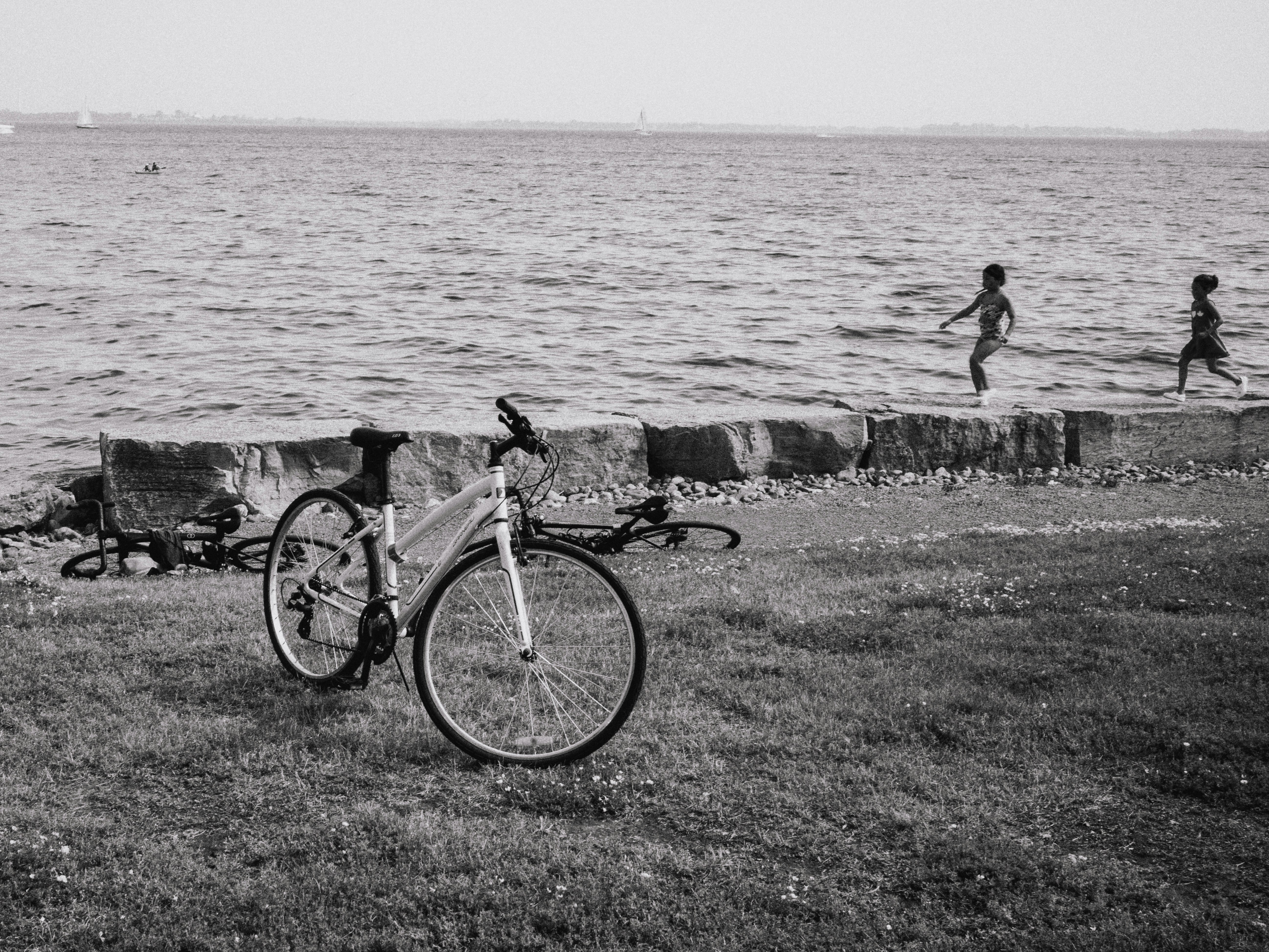 Bike by the Shore: Quiet Texture of Pebbles and Waves