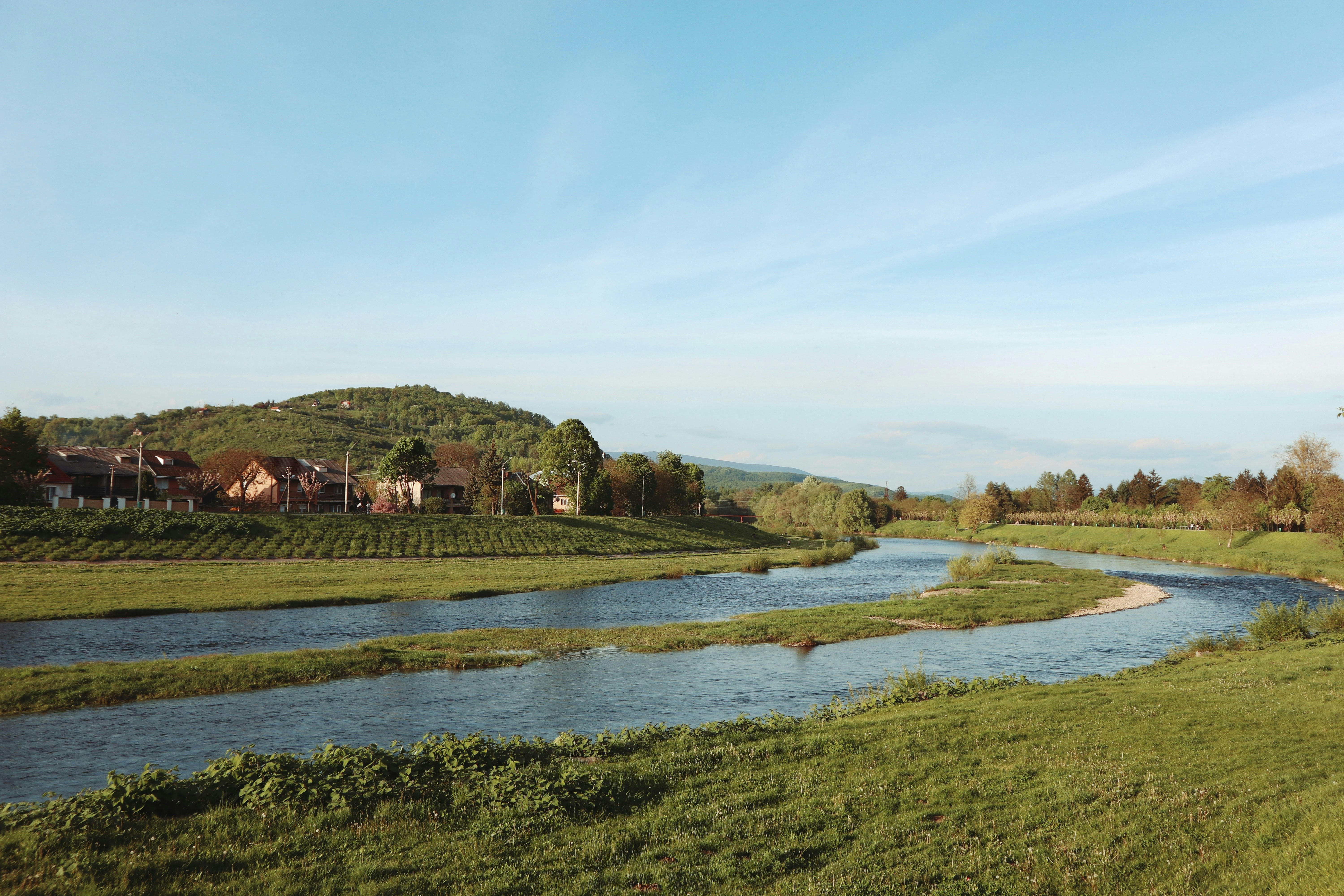 Riverside Village Halftime: A Tranquil Bend Under Open Sky