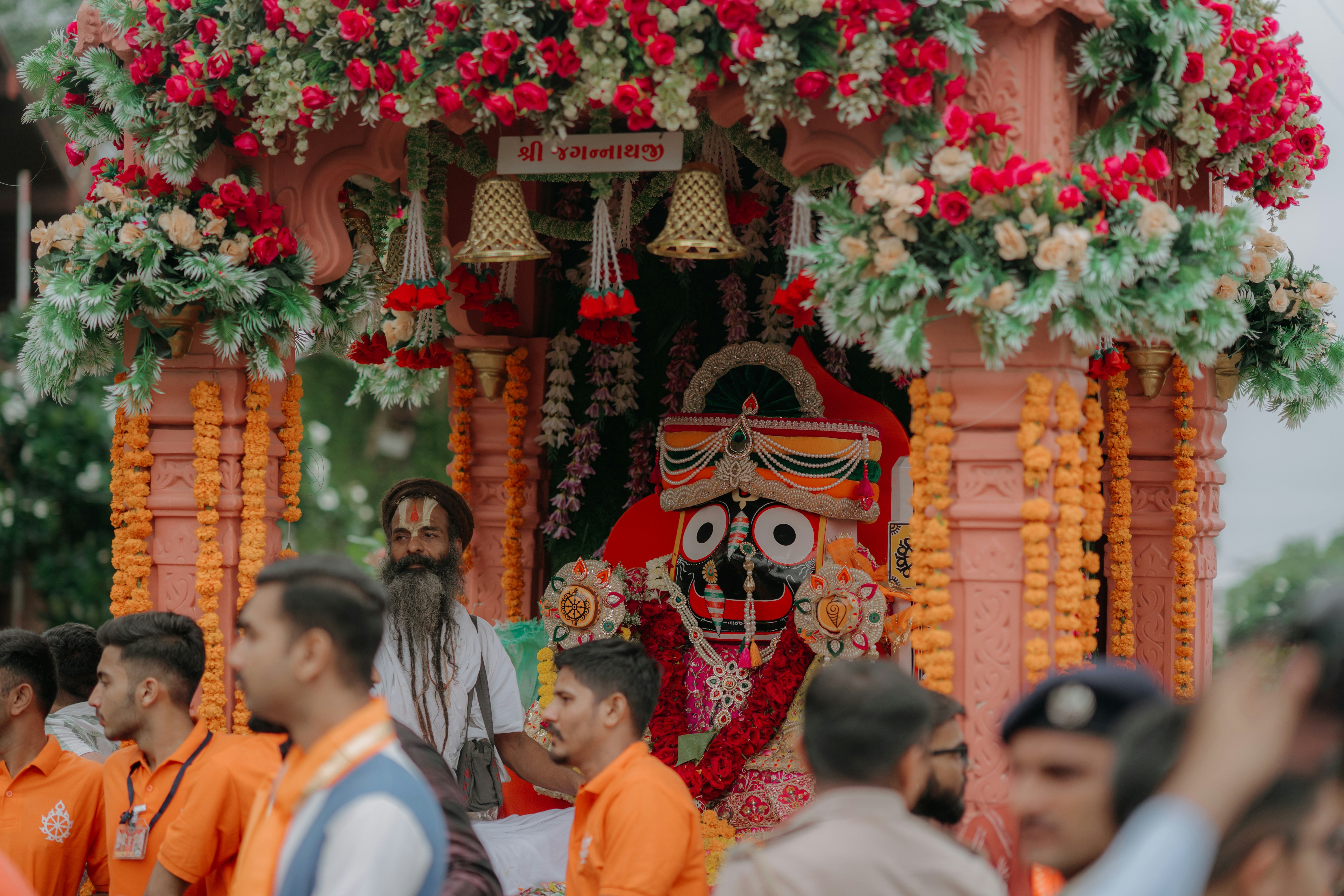 Carnival Shrine: A Festive Carved Tableau in Orange Flower Frames