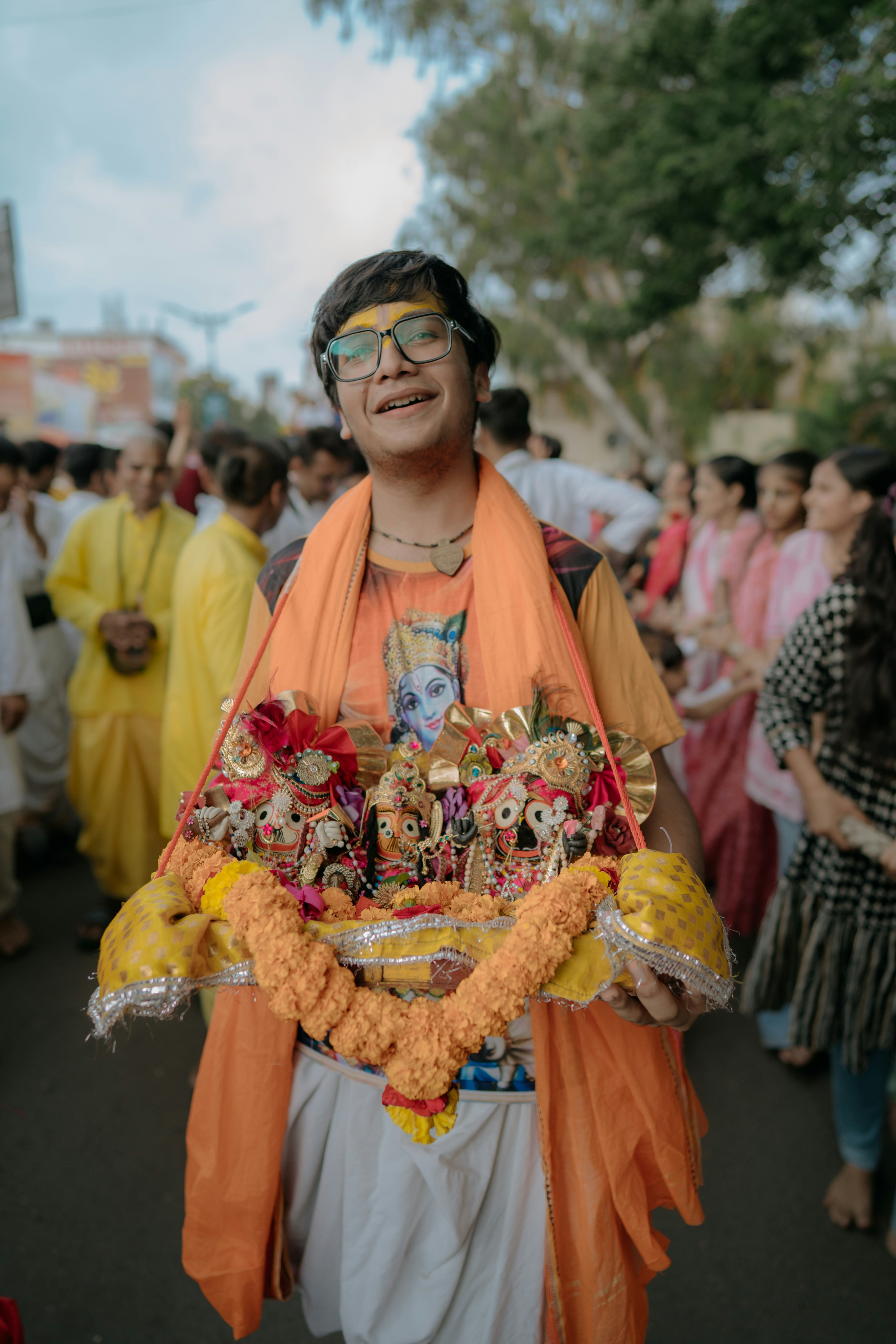 Joyful Decor and Garlands: A Festival Participant with Handheld Offerings