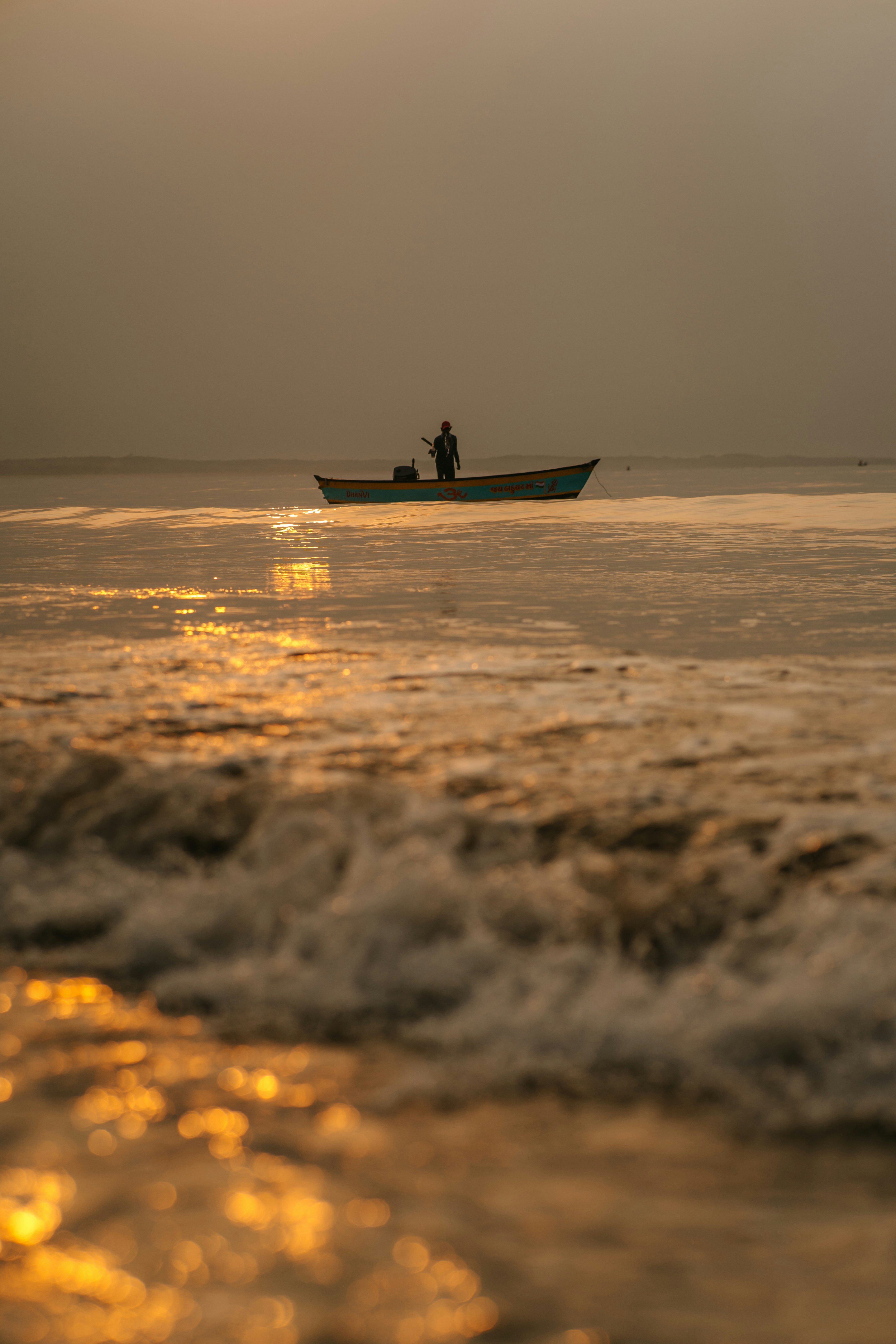 Boat at Dusk: A lone figure steadying the horizon