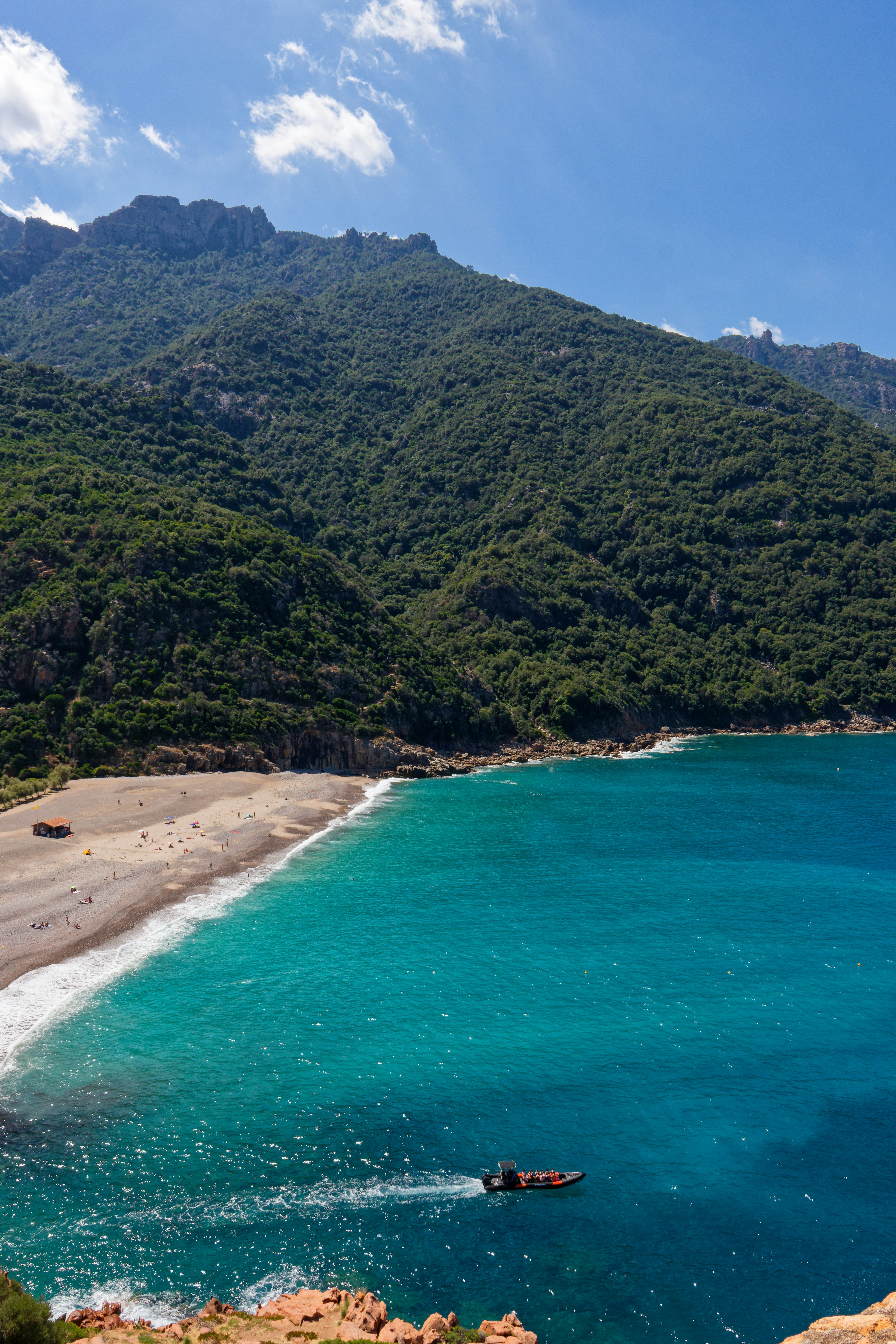 Azure Coastline Between Green Cliffs