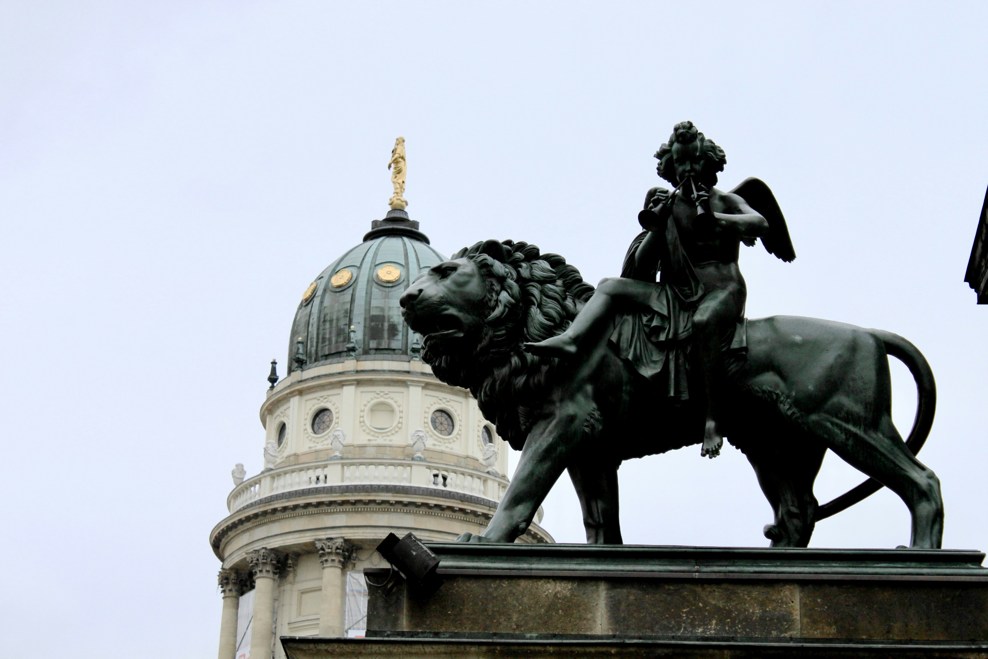 Guardian on the Plinth: A Lion Cavalry in Front of a Domed Capitol
