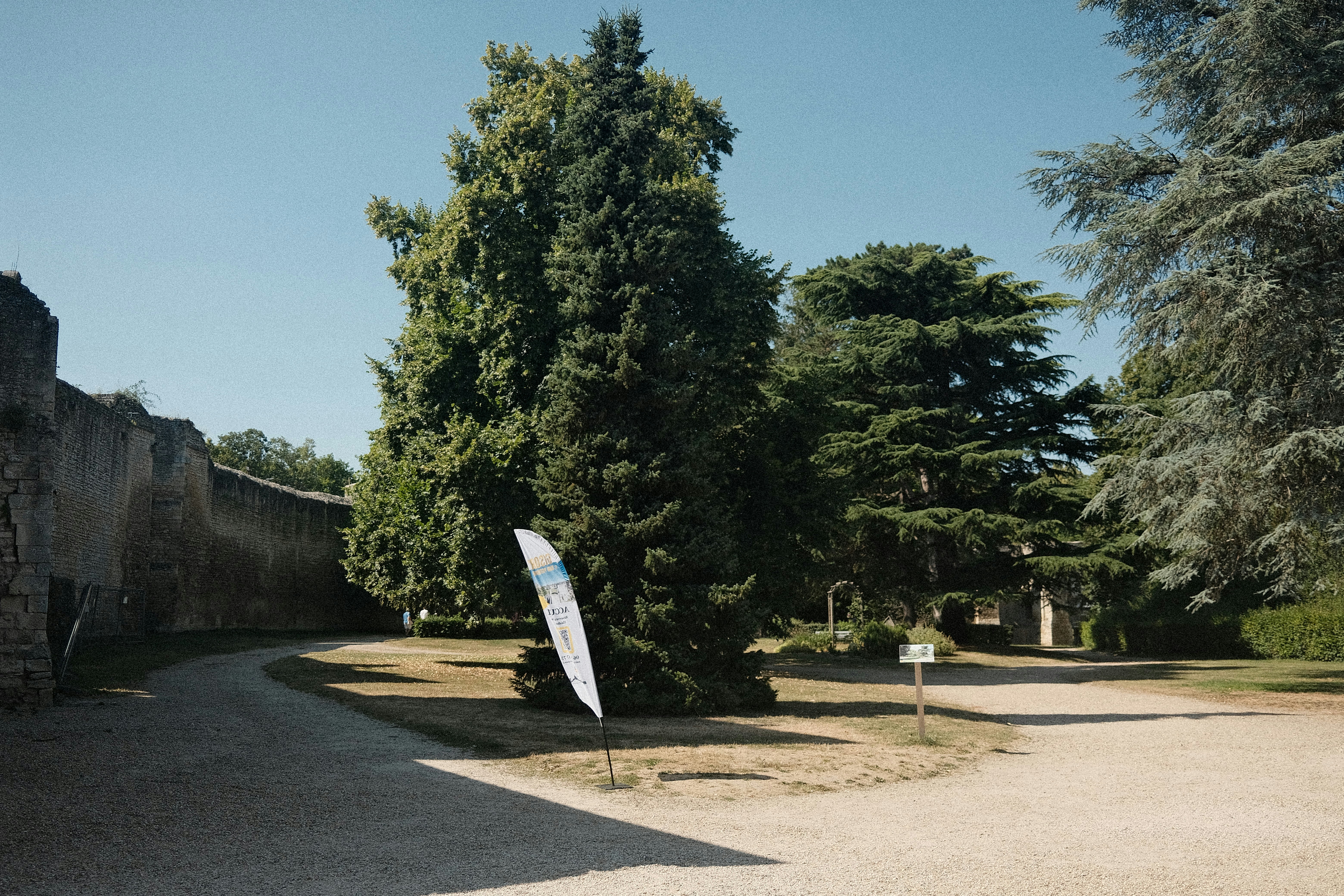 Flagged Banner by Weeping Shade: A Quiet Park Entry