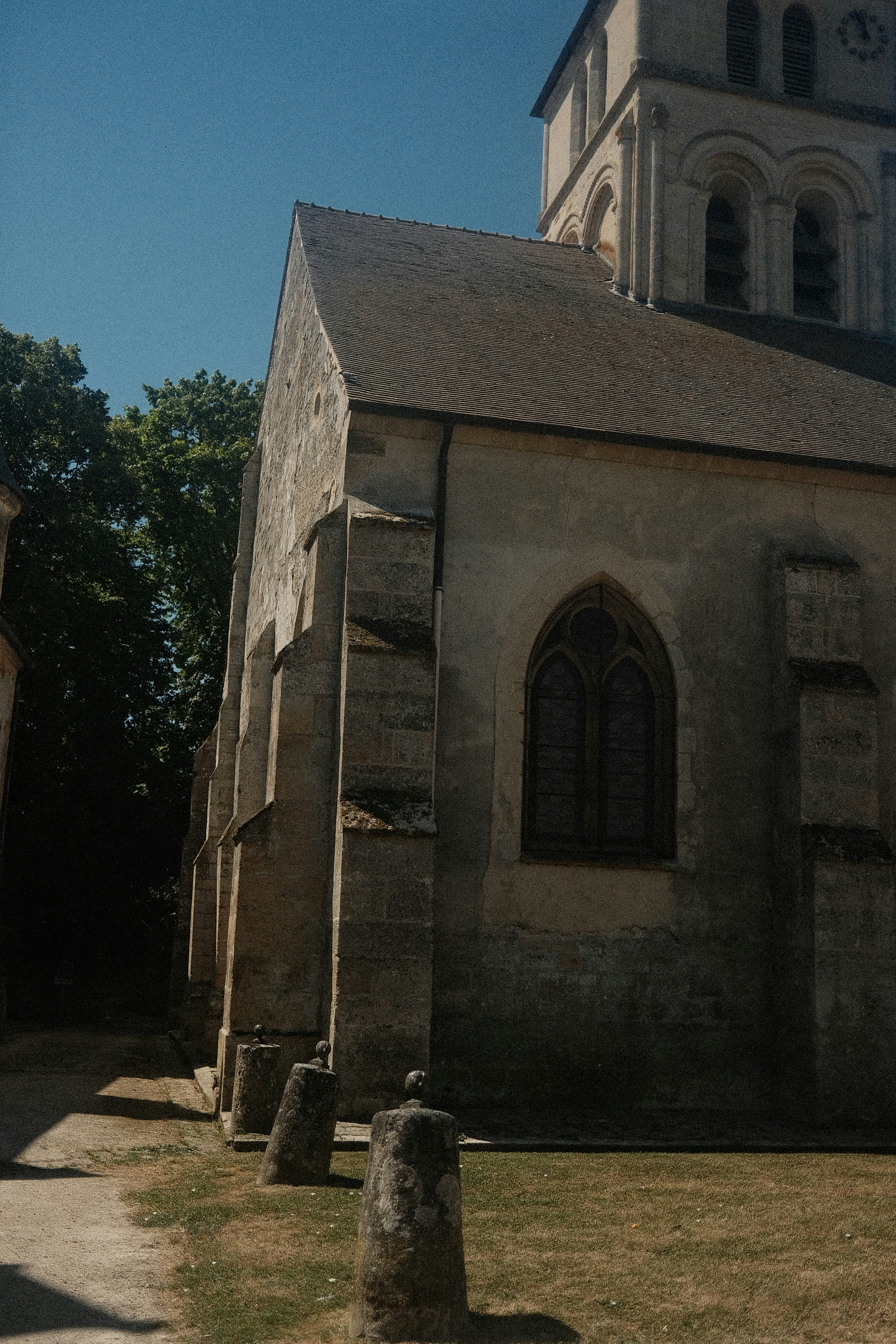 Stone Church in Shadowed Courtyard