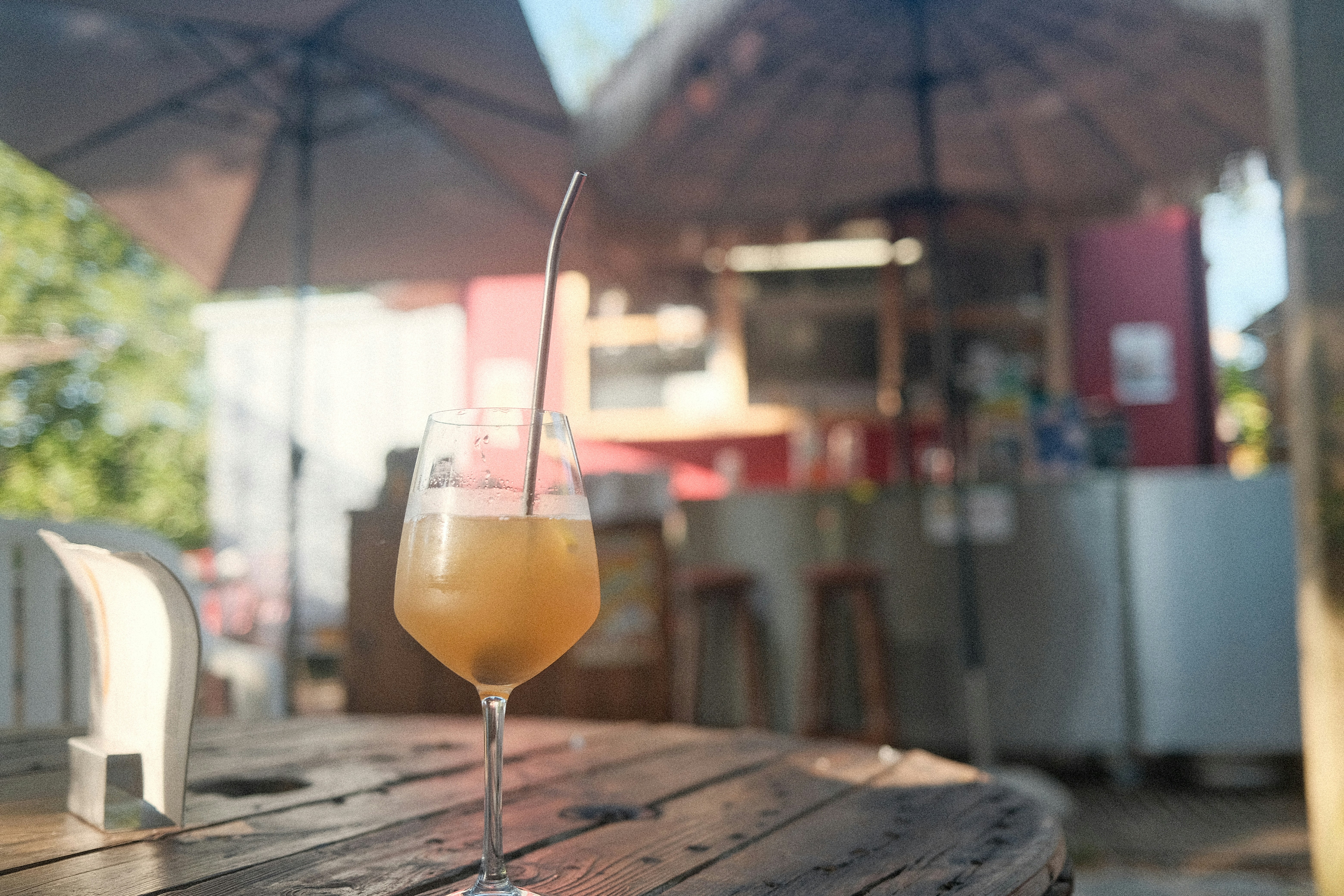 Sunlit cocktail on a rustic patio
