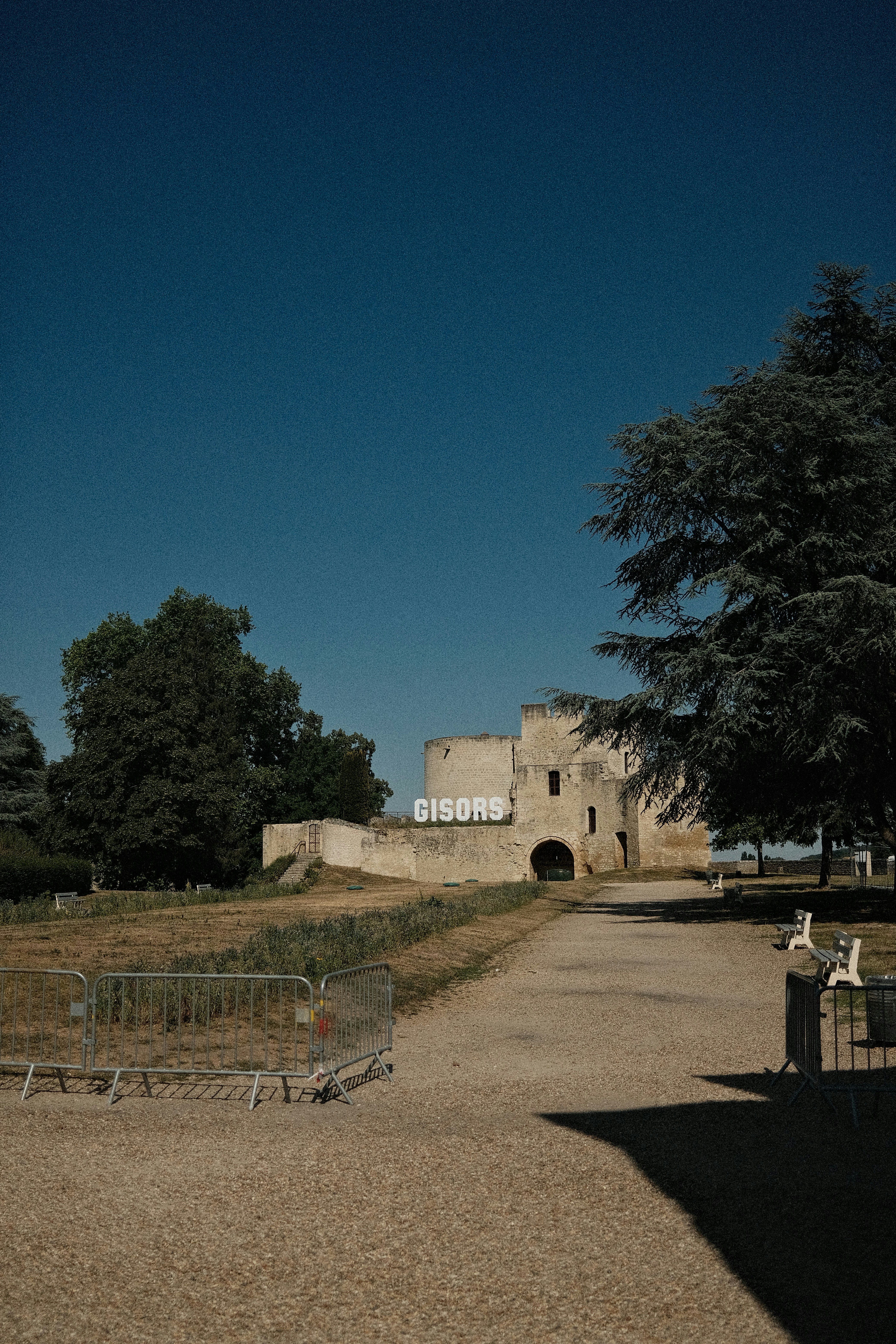Garrison Gate at Gisors: Sunlit Courtyard and Historic Facade