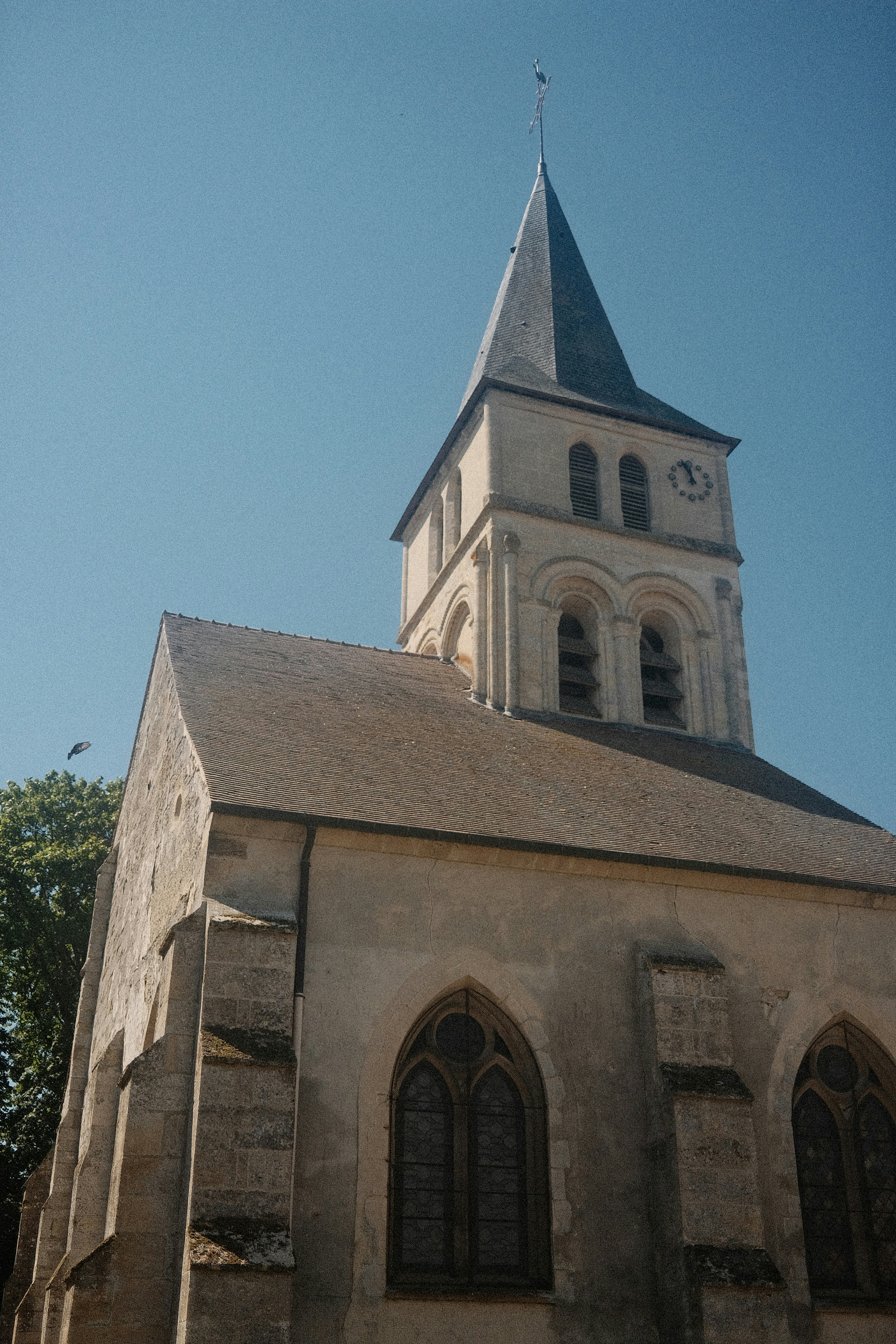 Steepled Silence: A Sunlit Chapel Reaching Toward a Clear Sky
