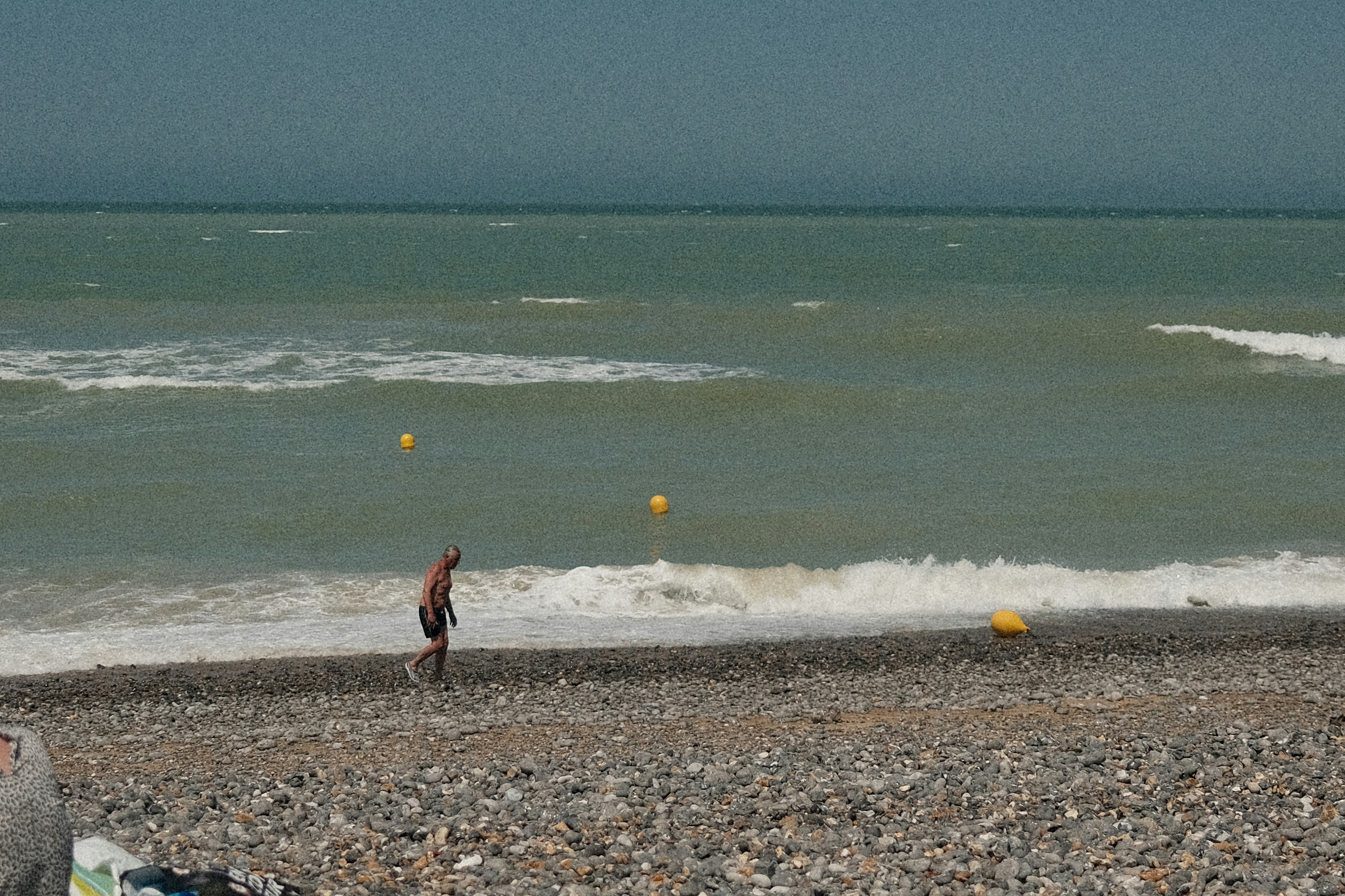 Gullied Shoreline Stroll Under a Quiet Sea Sky