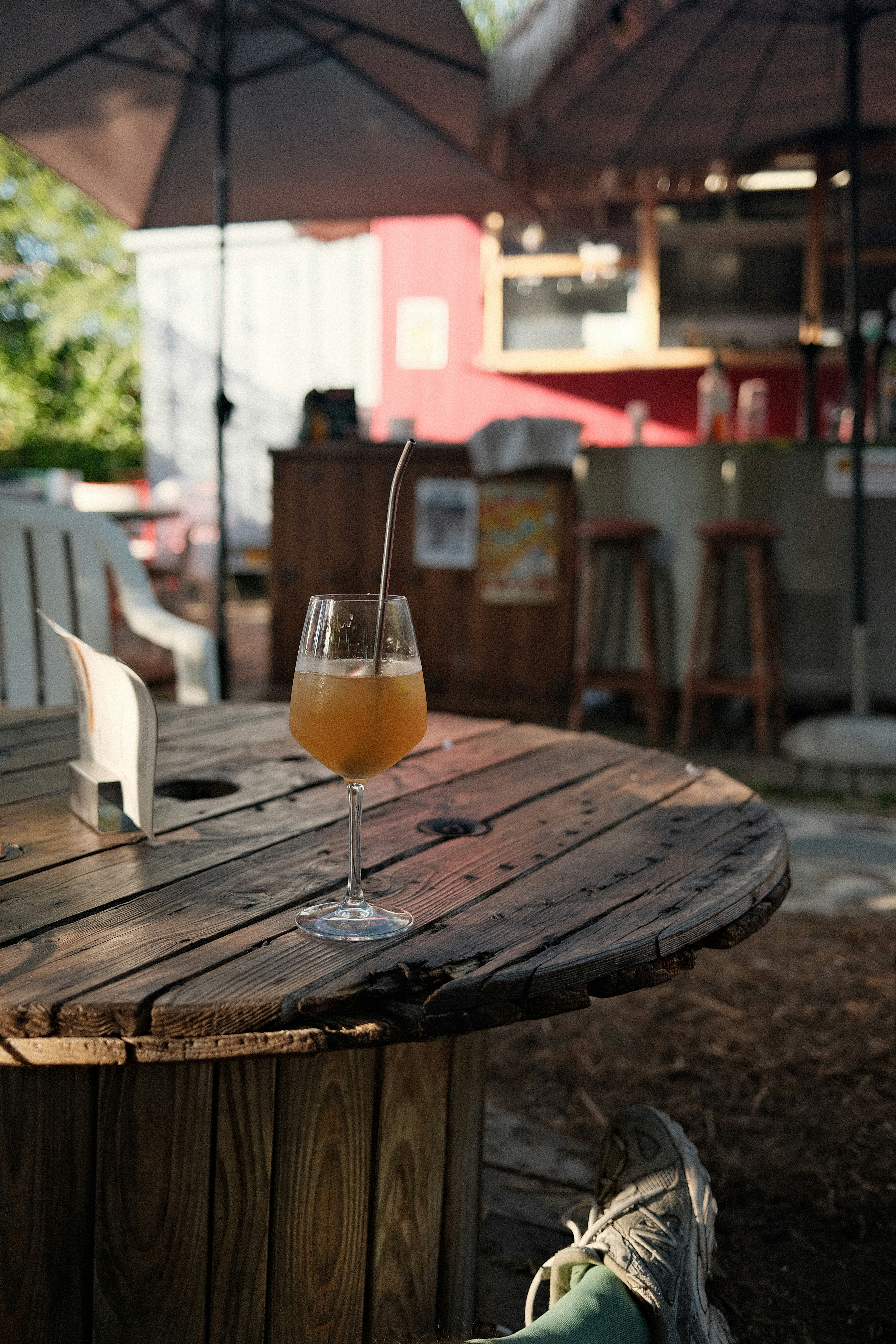 Sunlit Cocktail on a Weathered Table