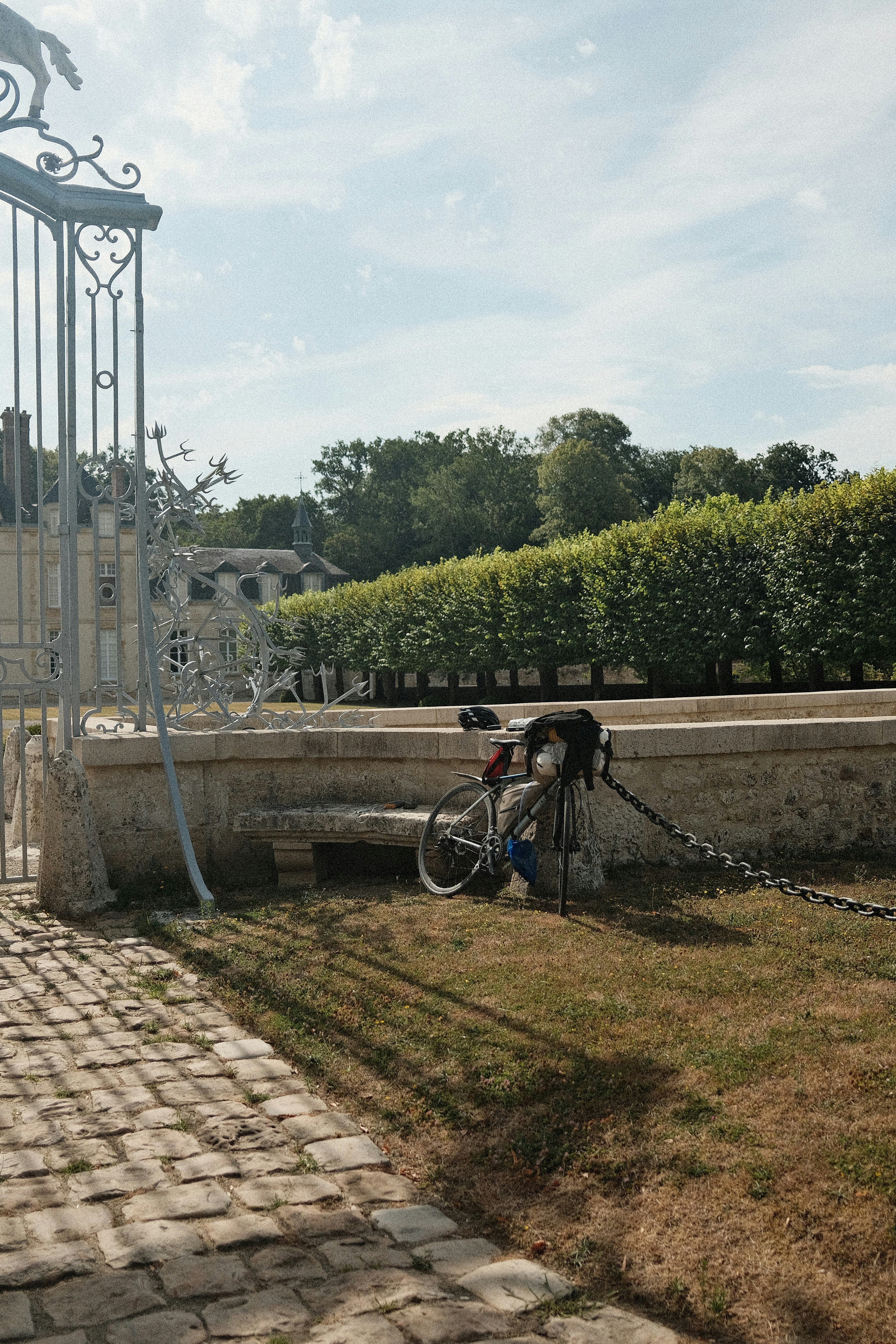 Bike by the Gate: Quiet Parkside Moment