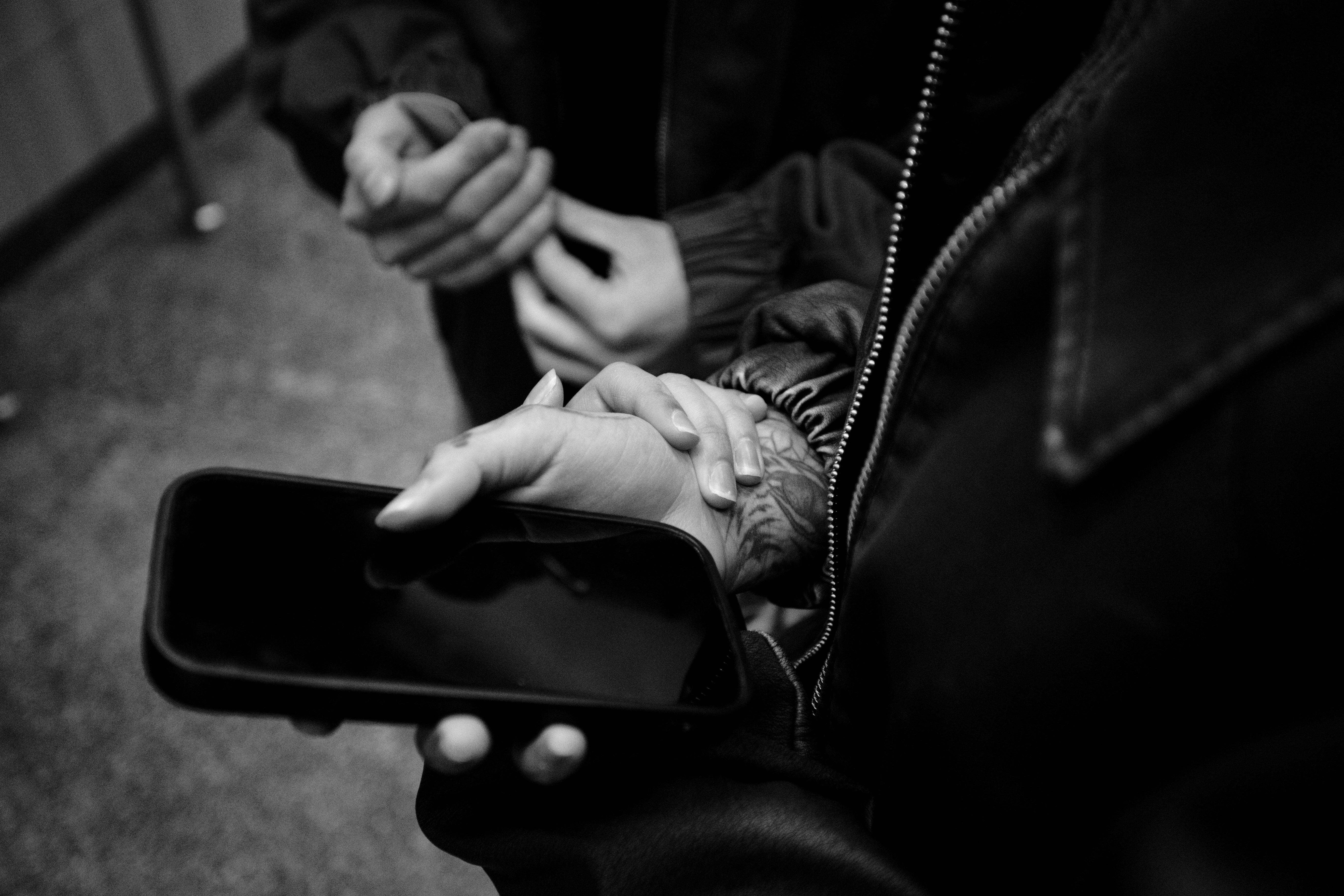 Between the Handshake and the Screen: A Quiet Moment in Black and White