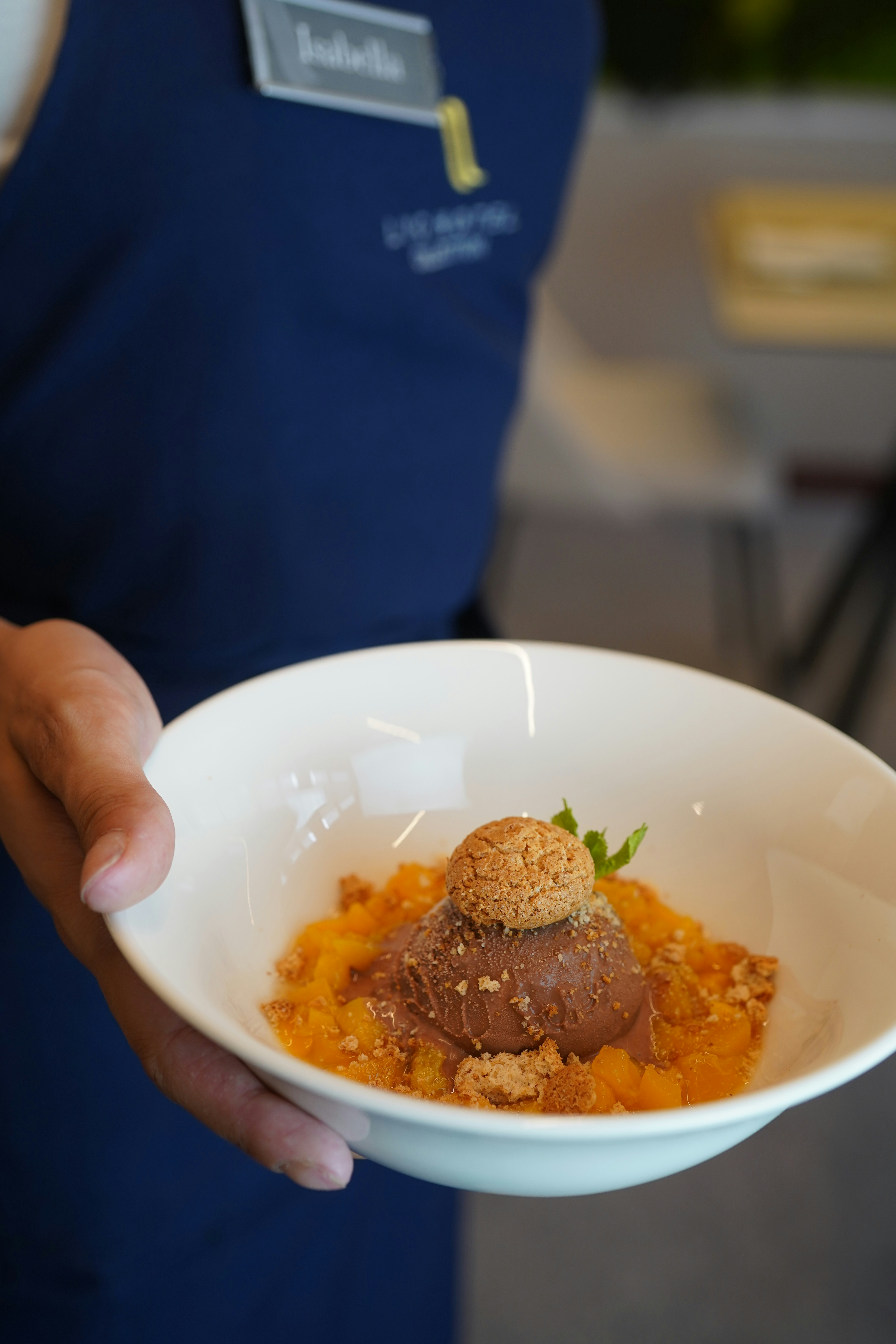 Dessert in Focus: A Hand-Crafted Bowl Presented by a Service Professional