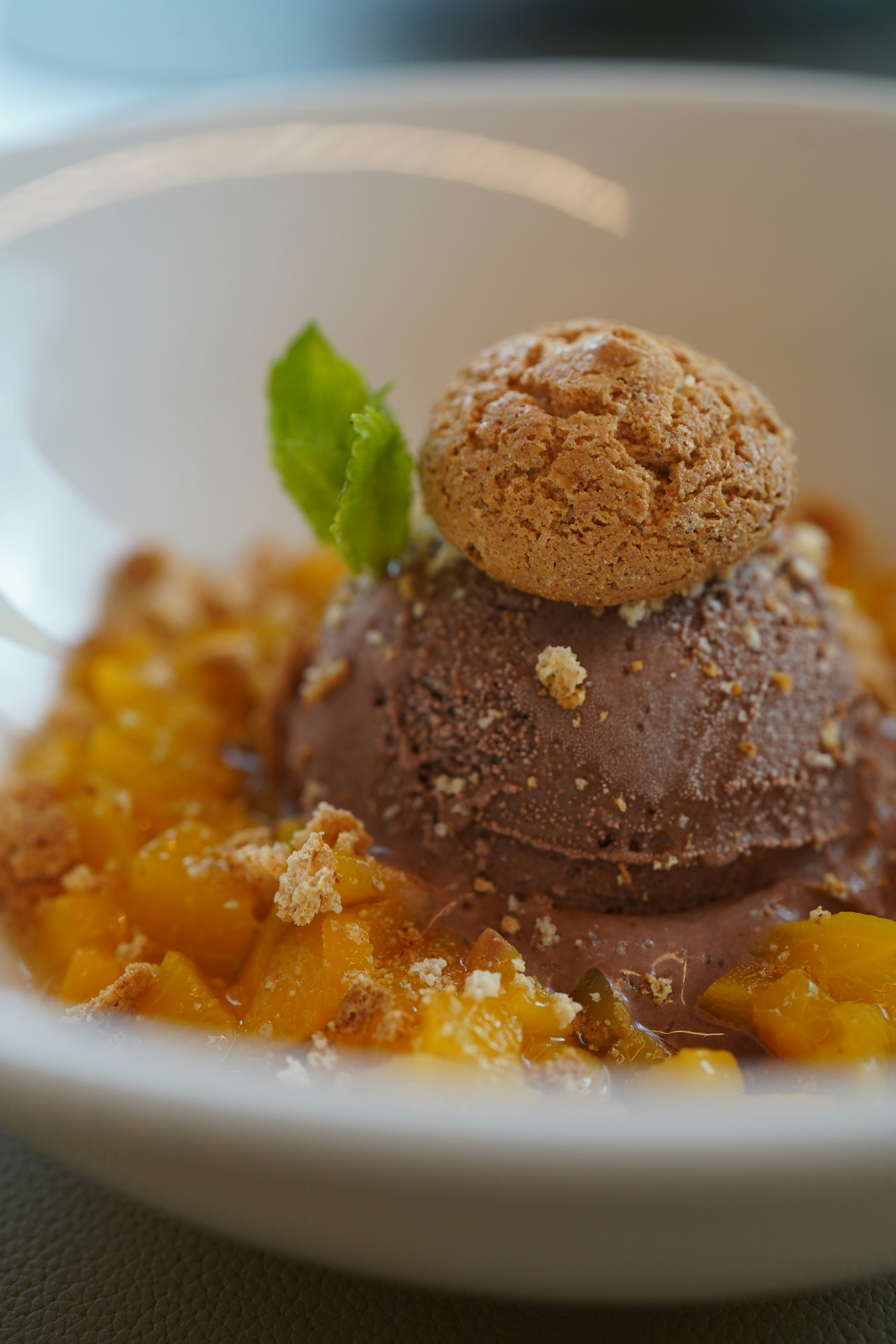 Chilled Chocolate Cone: A Scoop of Cocoa on Mango Crumble