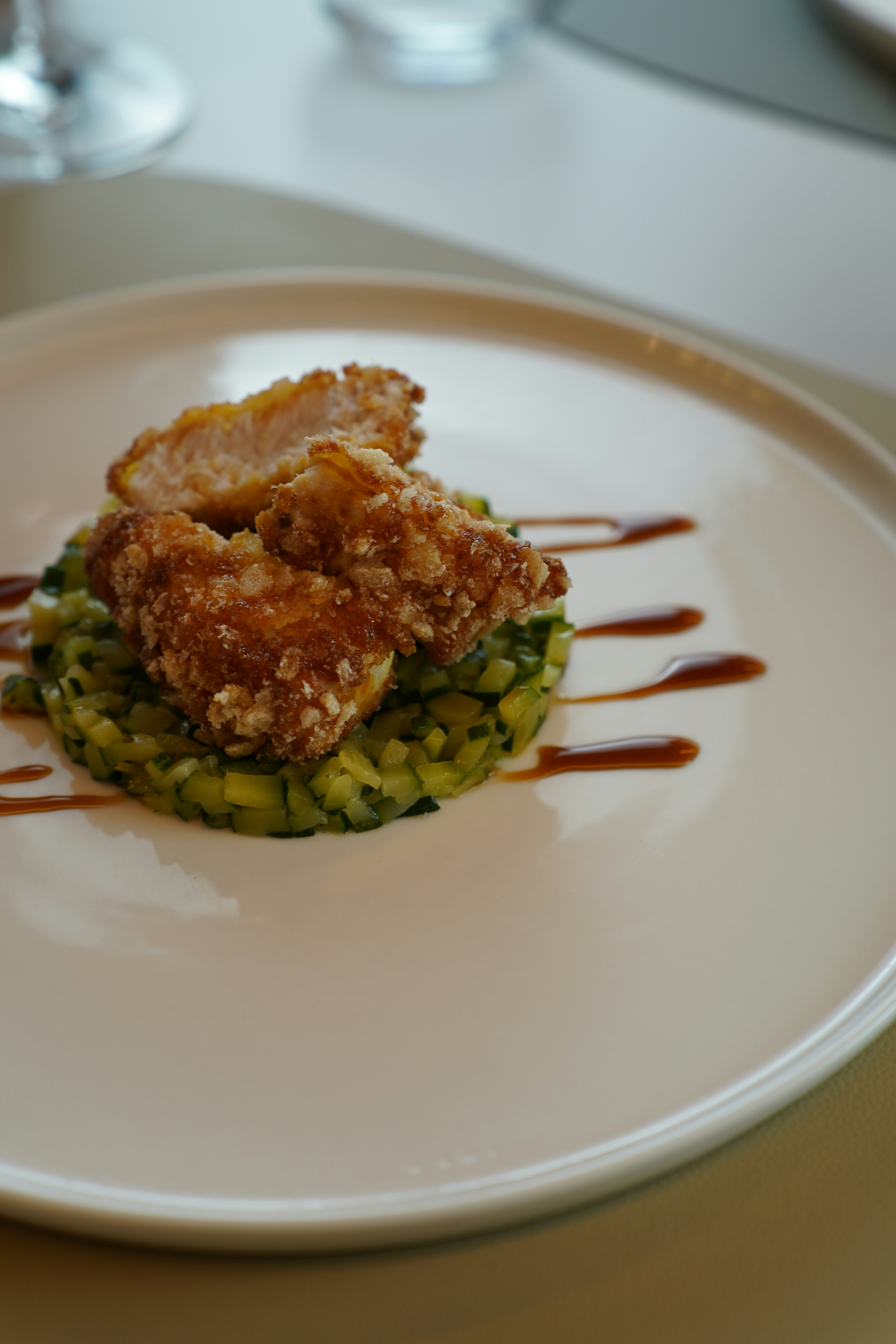 Crispy Fried Chicken over Mounded Cucumber Risotto with Balsamic Drizzle