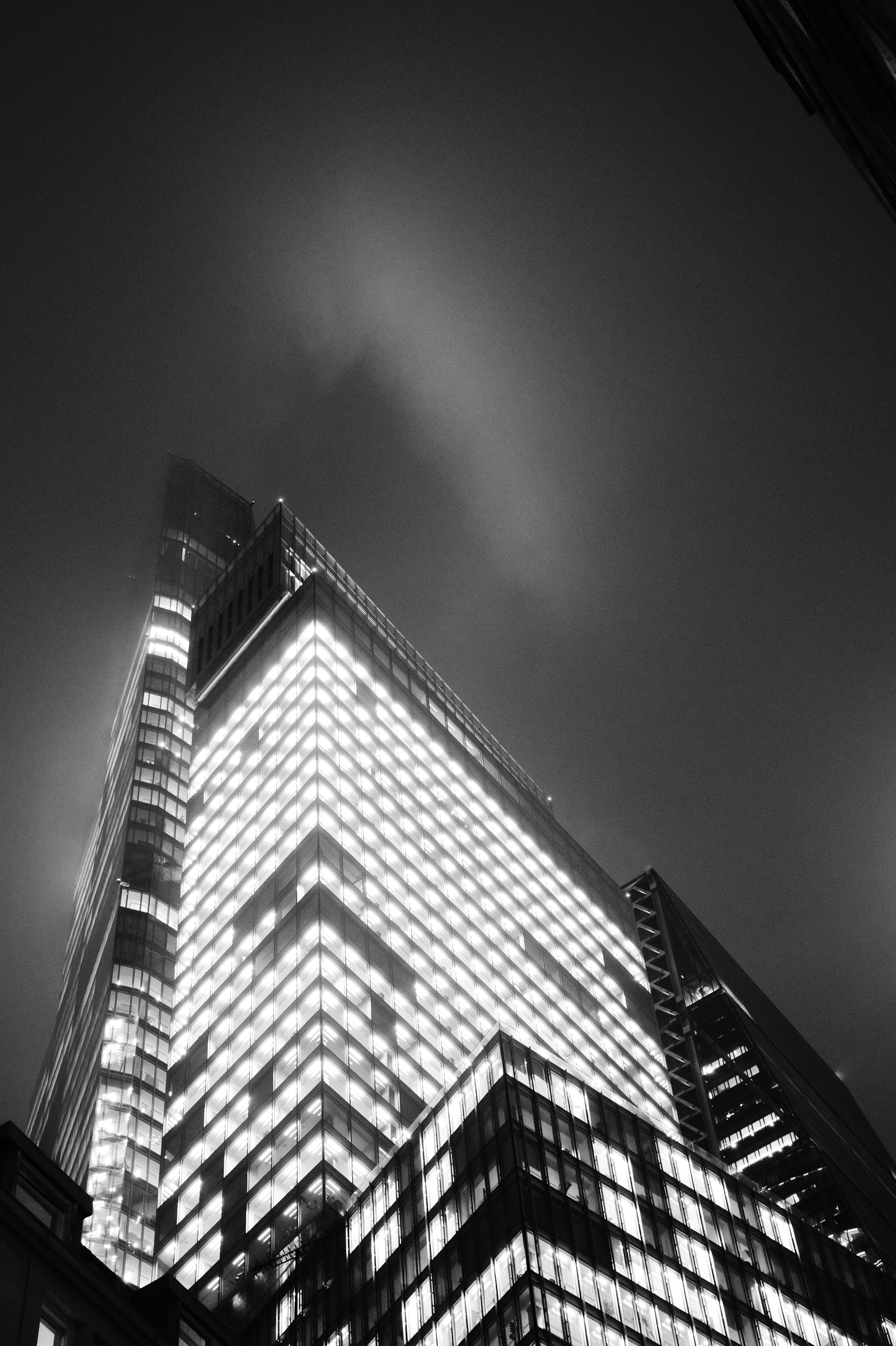 Neon Cathedral: Angled Skyscraper Lights Reach for Night