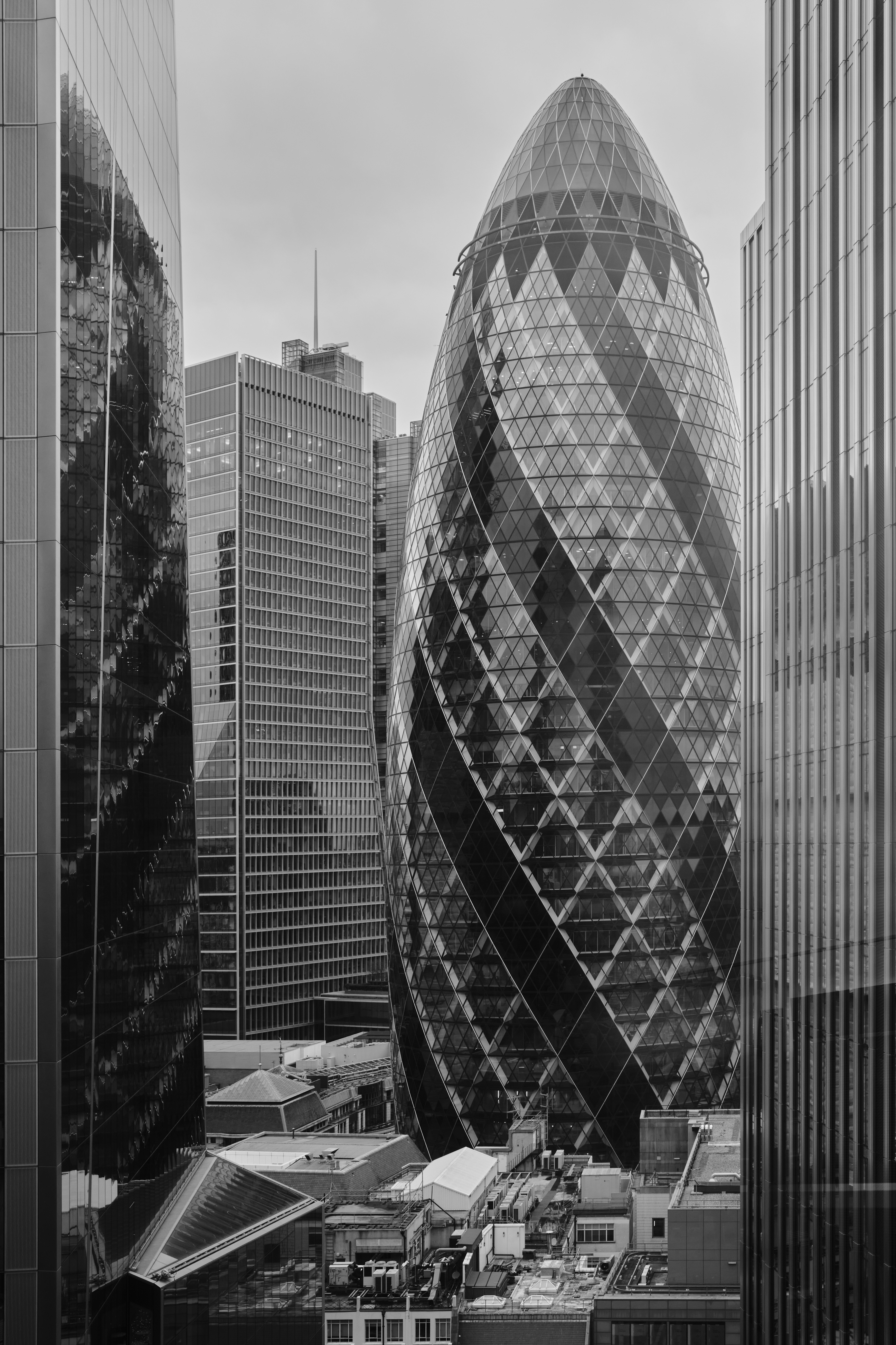 Facade of the Gherkin-in-Glass: Urban Diamond Facade Framed by Skyscrapers