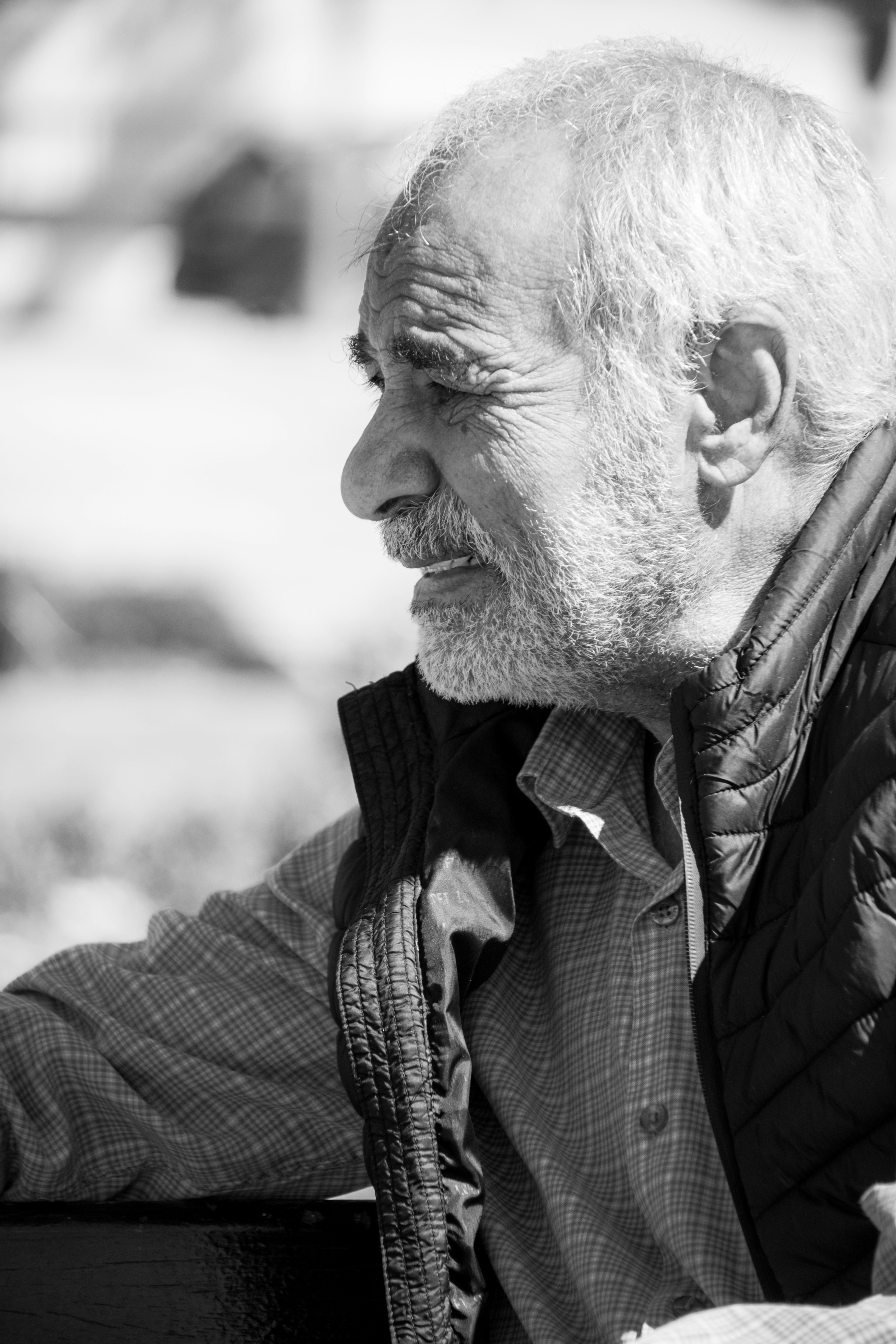 Portrait in profile: weathered wisdom under soft light