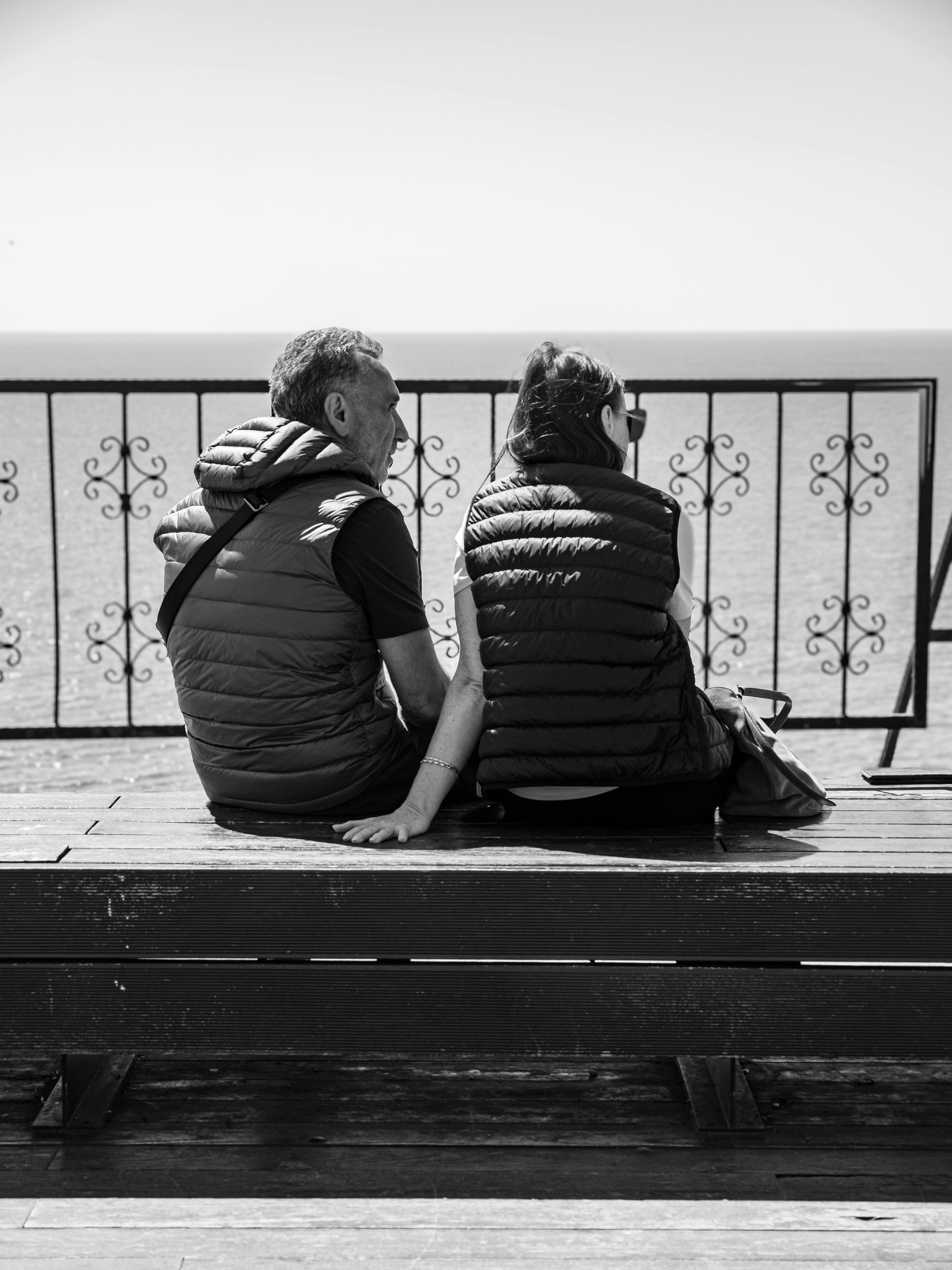 Quiet Conversation on a Seaside Promenade