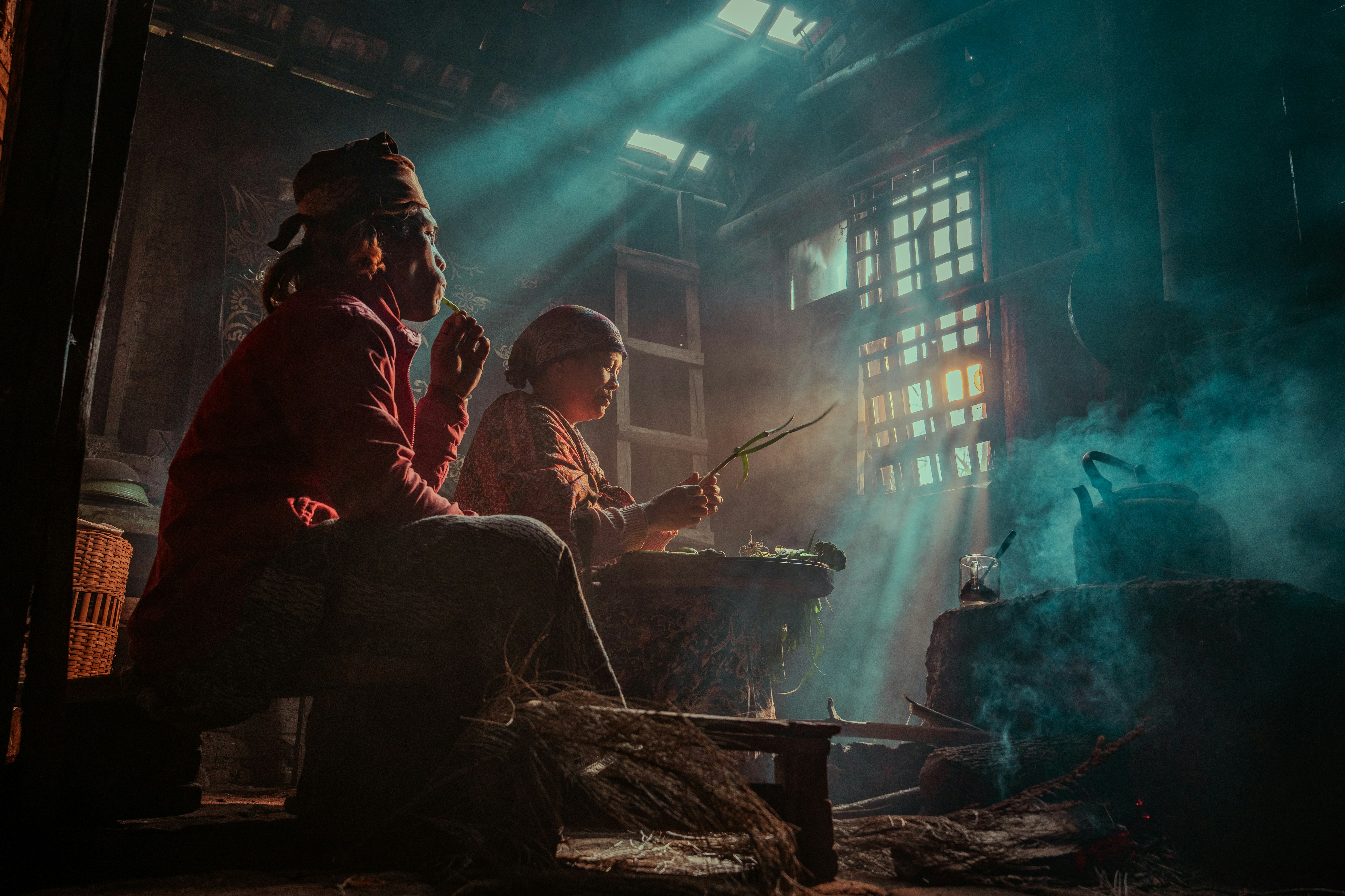 Quiet Firelight: Two Artisans in a Shadowed Workshop