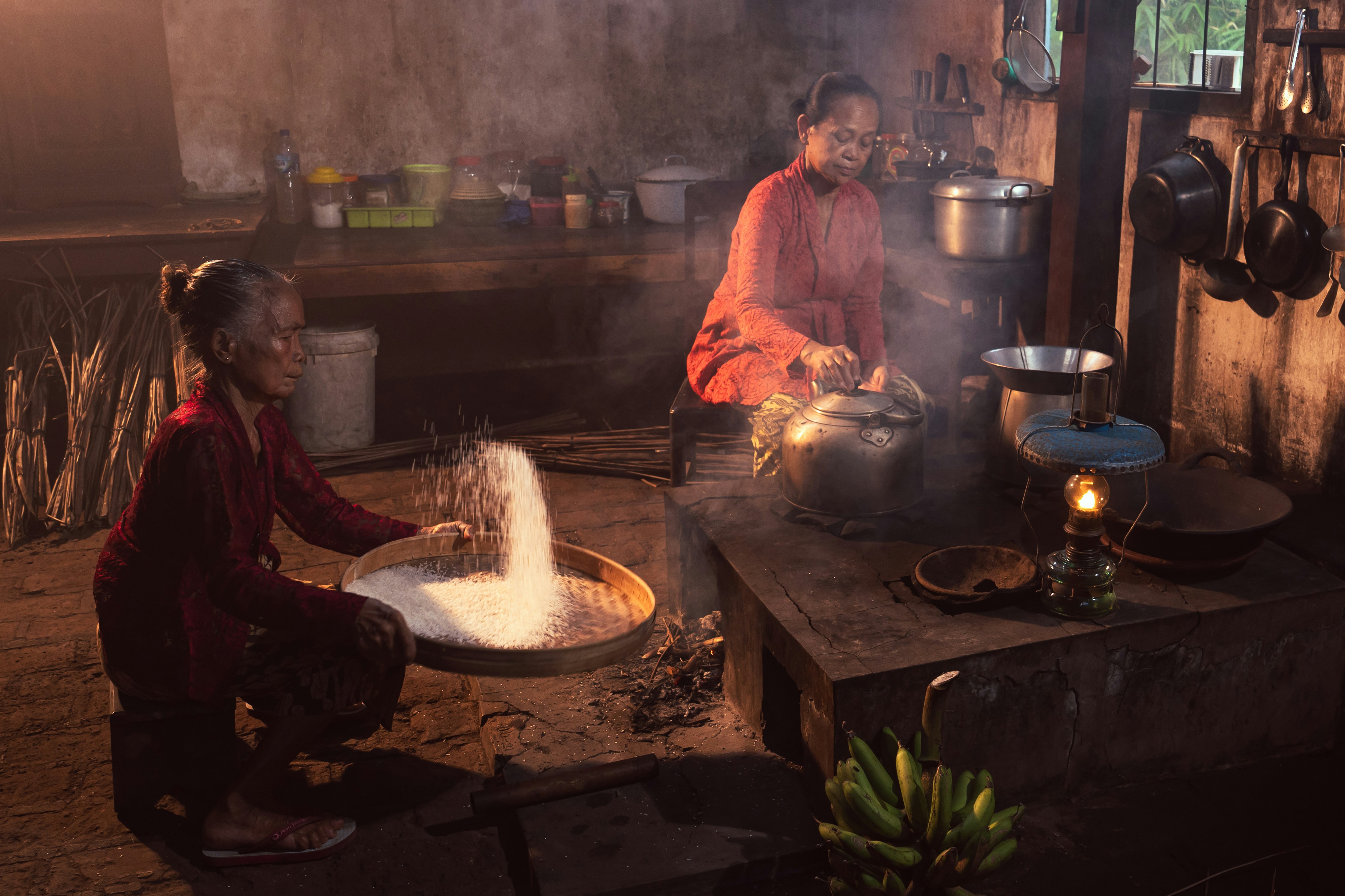 Steam and Shelter: Women tending the hearth in a sunken kitchen