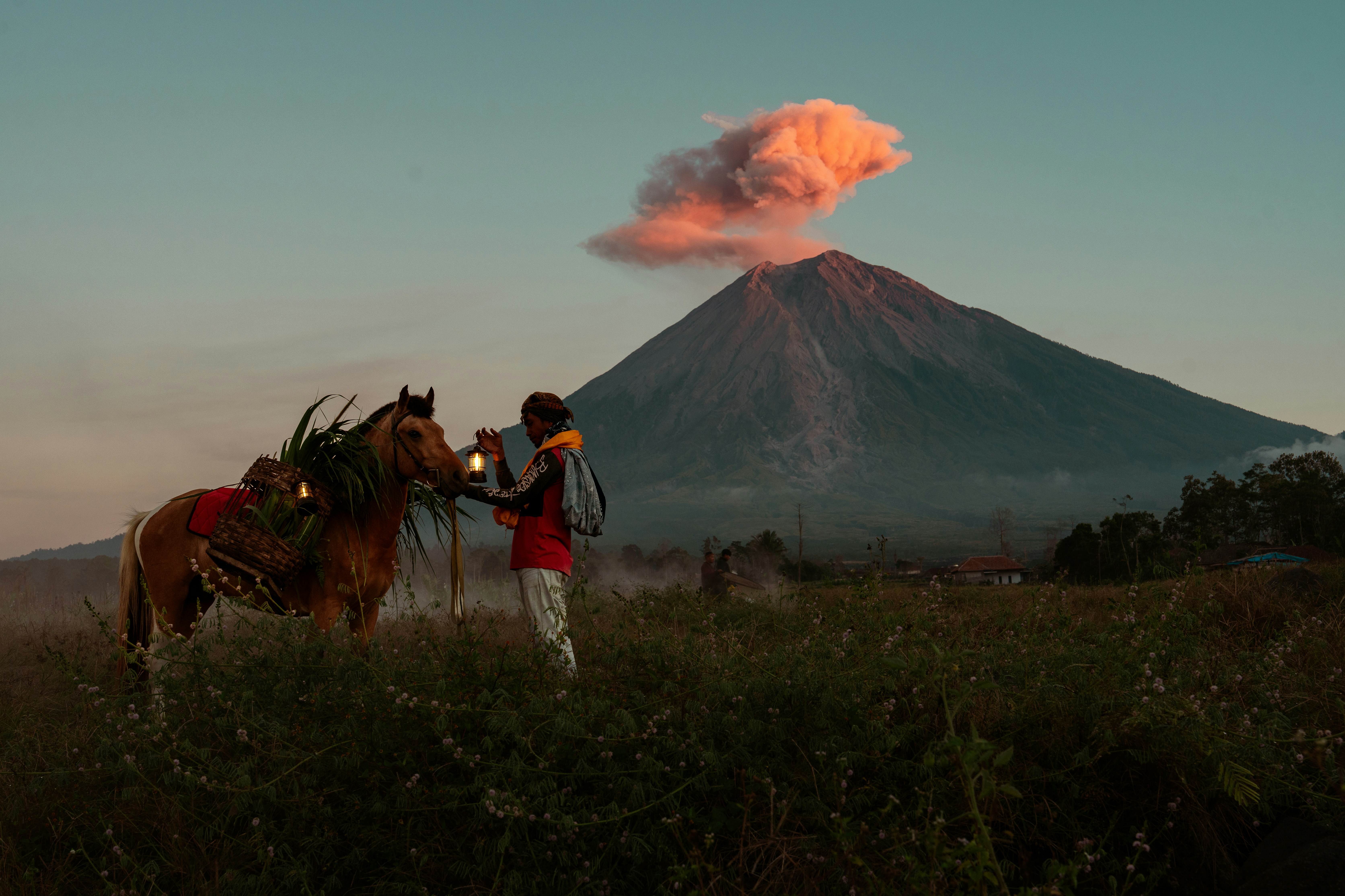 Beside the Volcano: A Moment of Offering at Dusk
