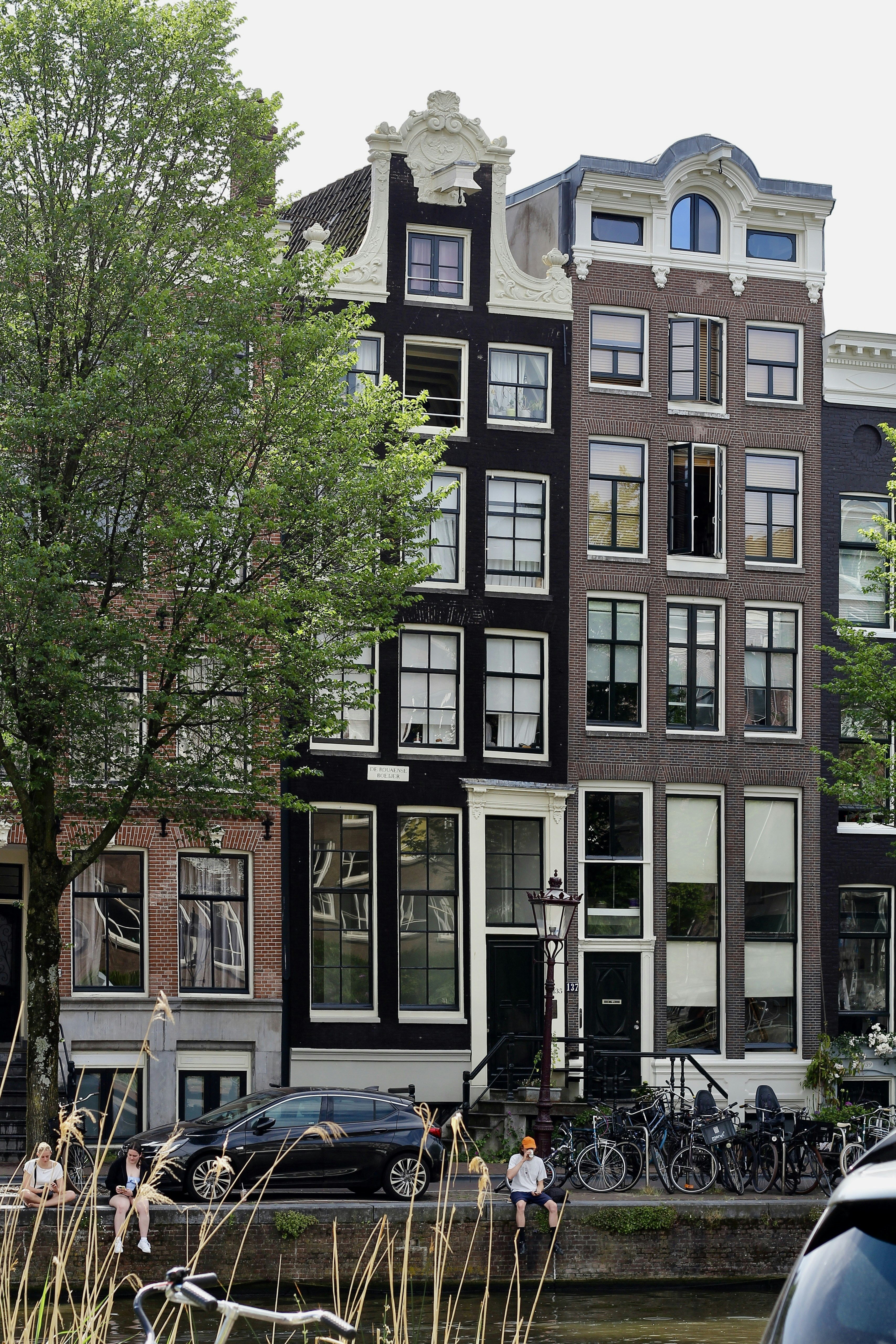 Canalfront Facades: A Quiet Moment Along Amsterdam's Historic Gables