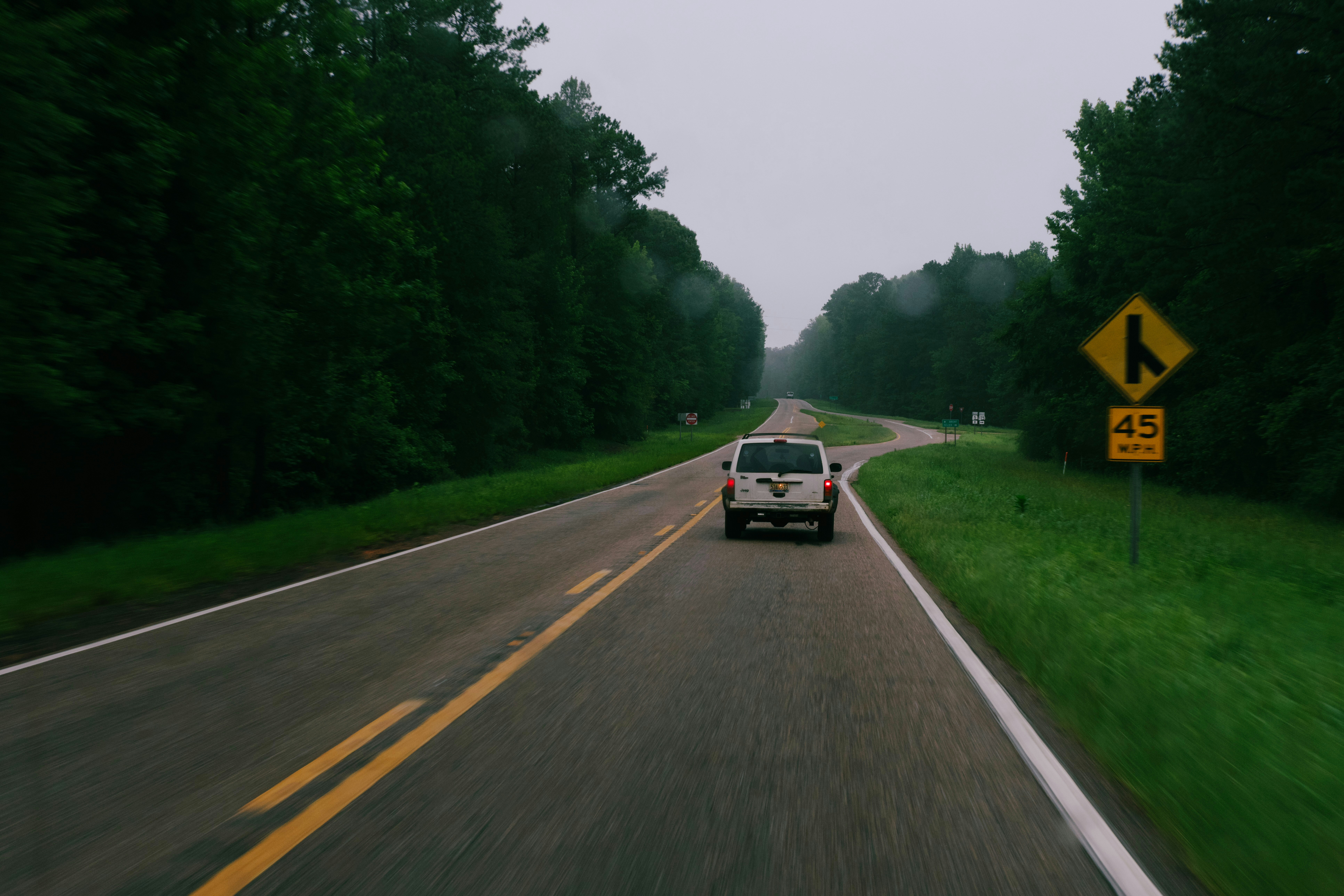 Toward the Bend: A Quiet Road Trip Under Overcast Skies