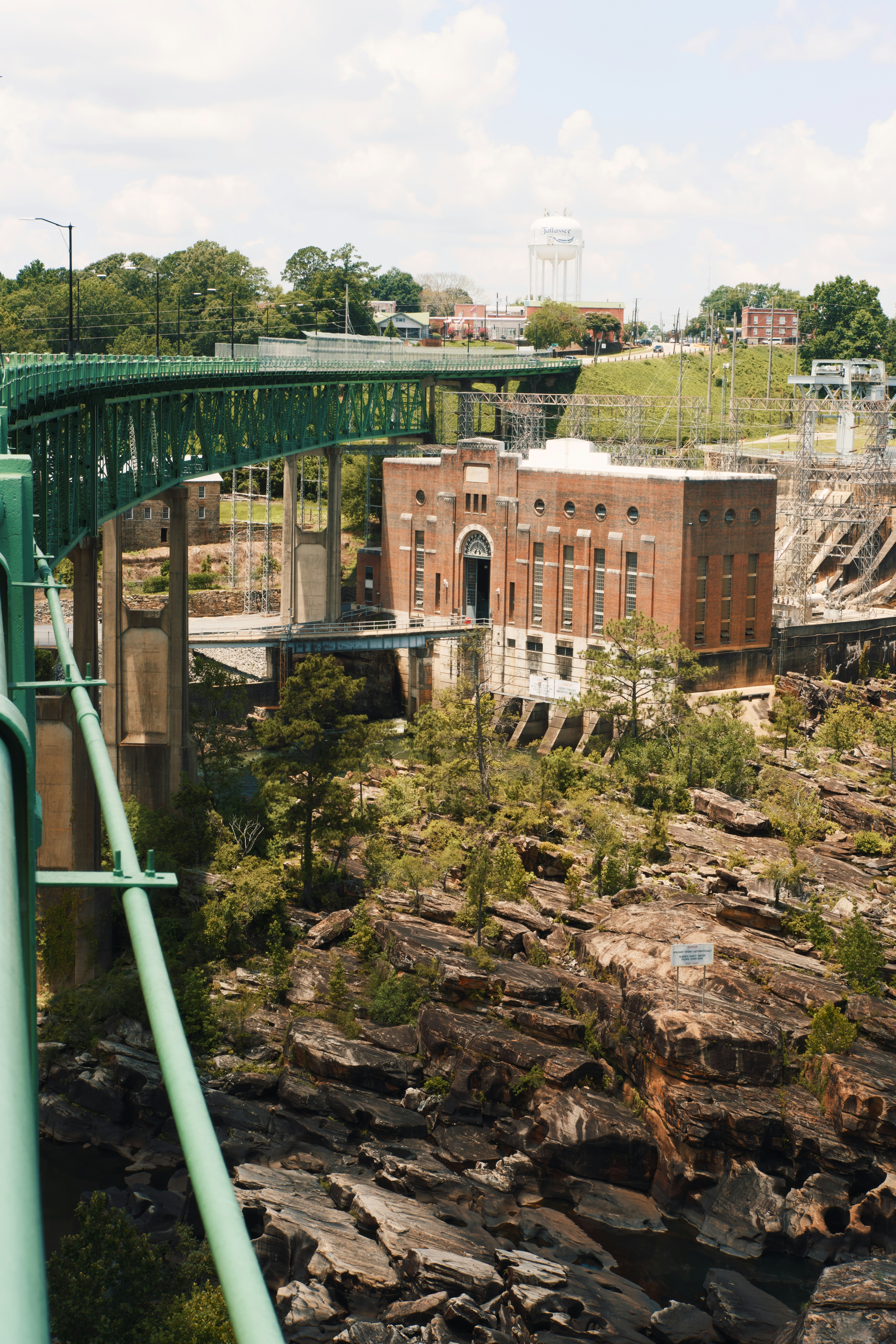 Iron Gorge: A Green Span Over A Historic Brick Waterfront