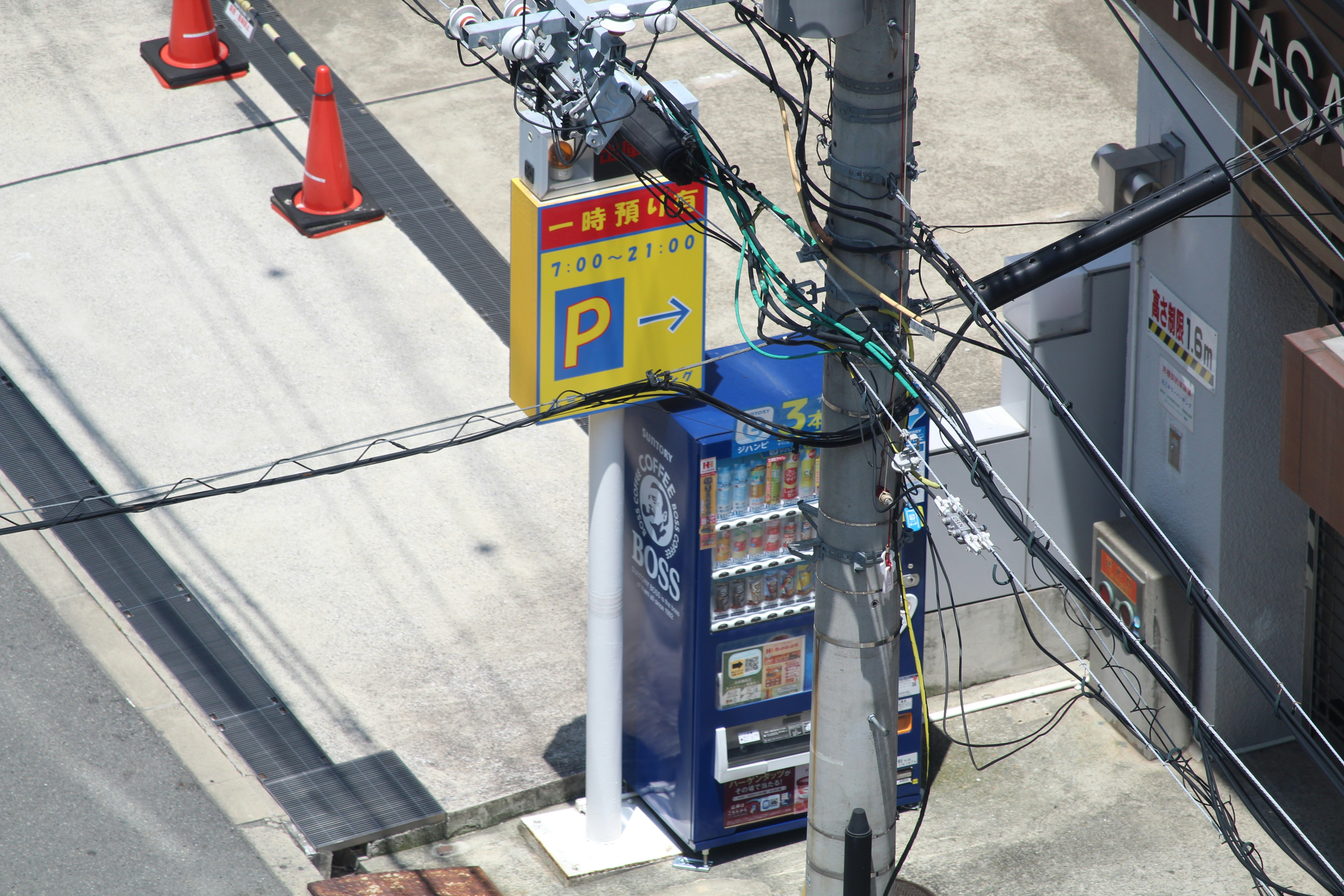 Urban street corner with vending machine and power lines
