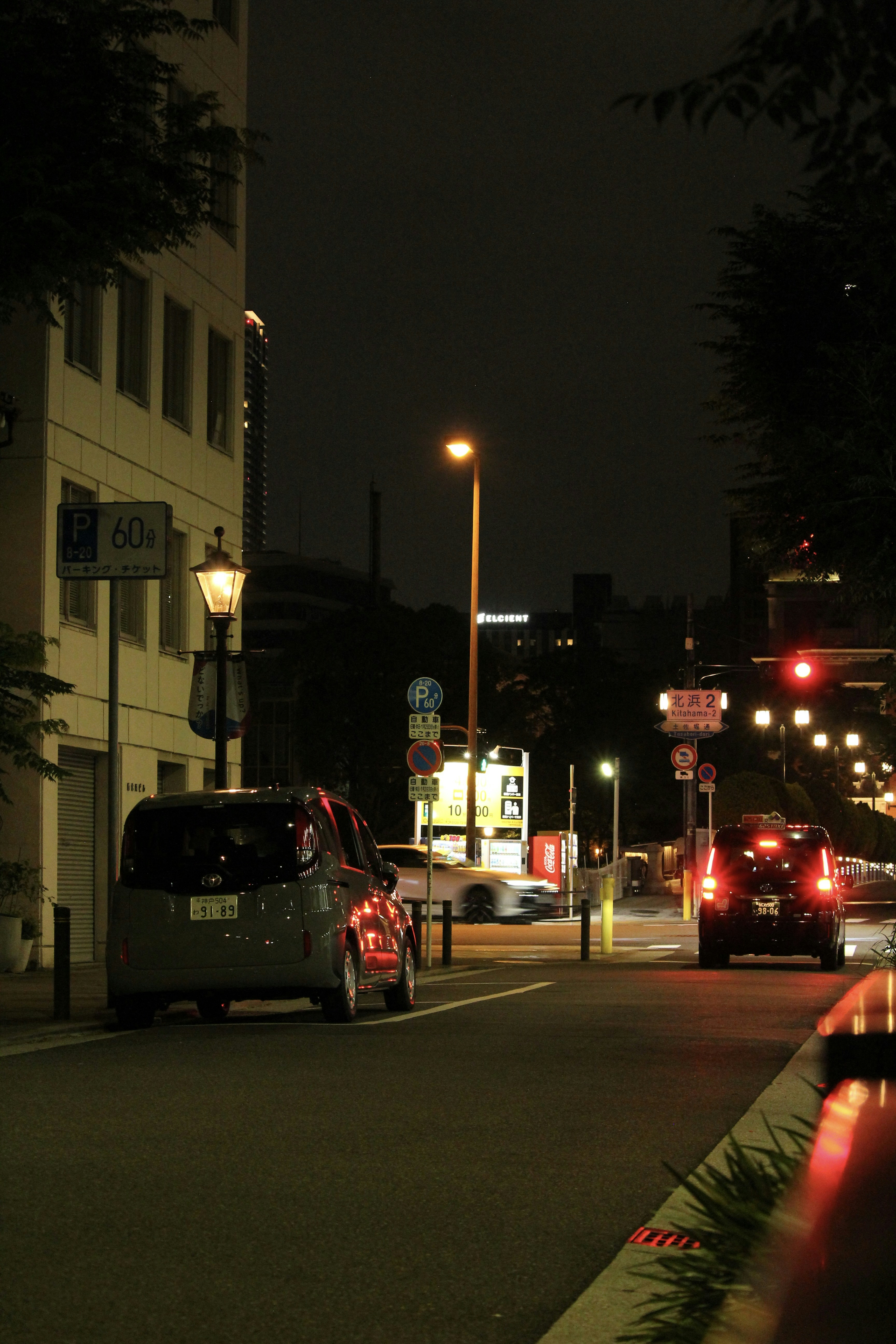 Night Street Pulse: Neon Cars and Quiet Streetlight