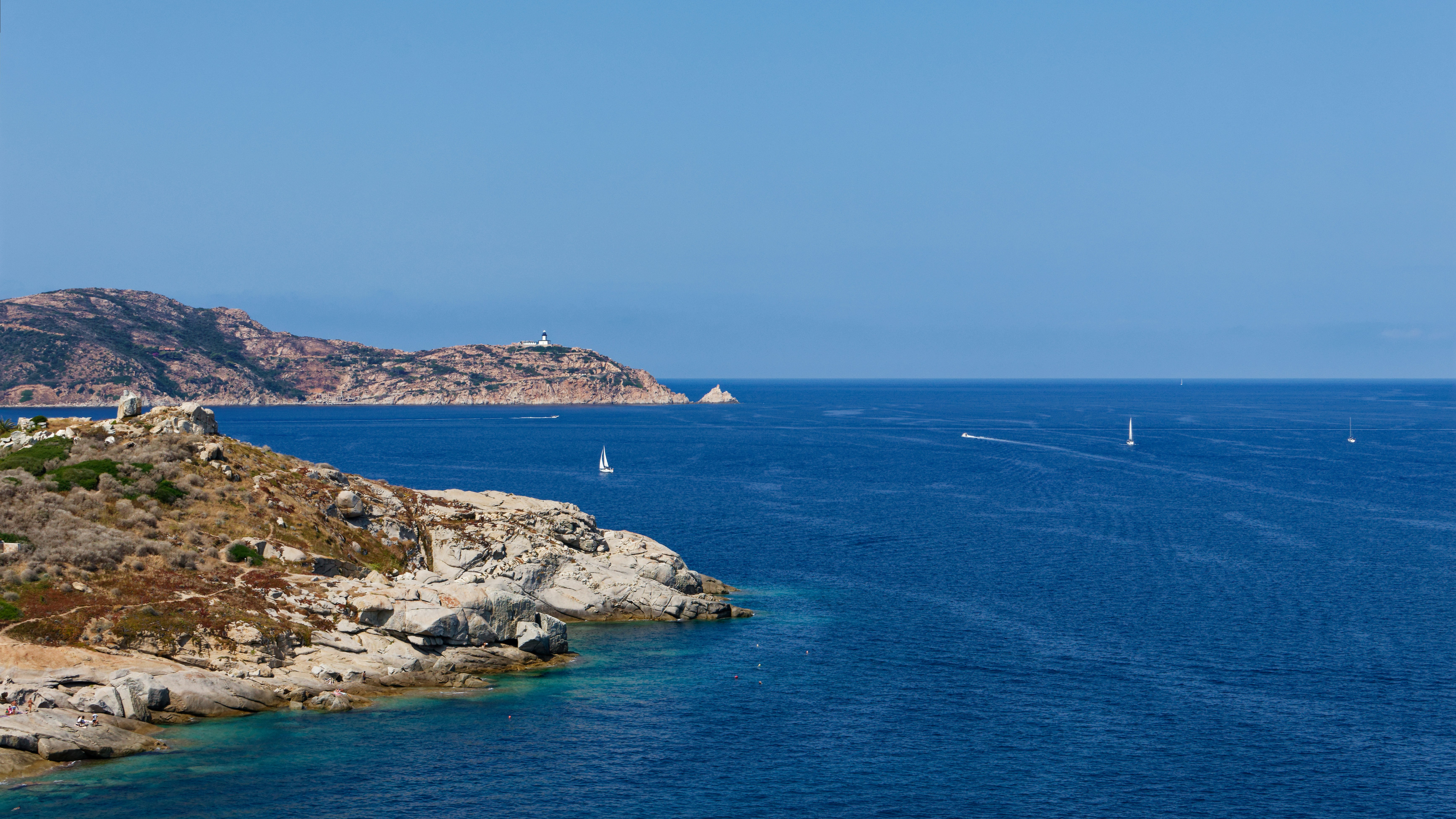 Limestone Coastline Meets a Calm Blue Sea
