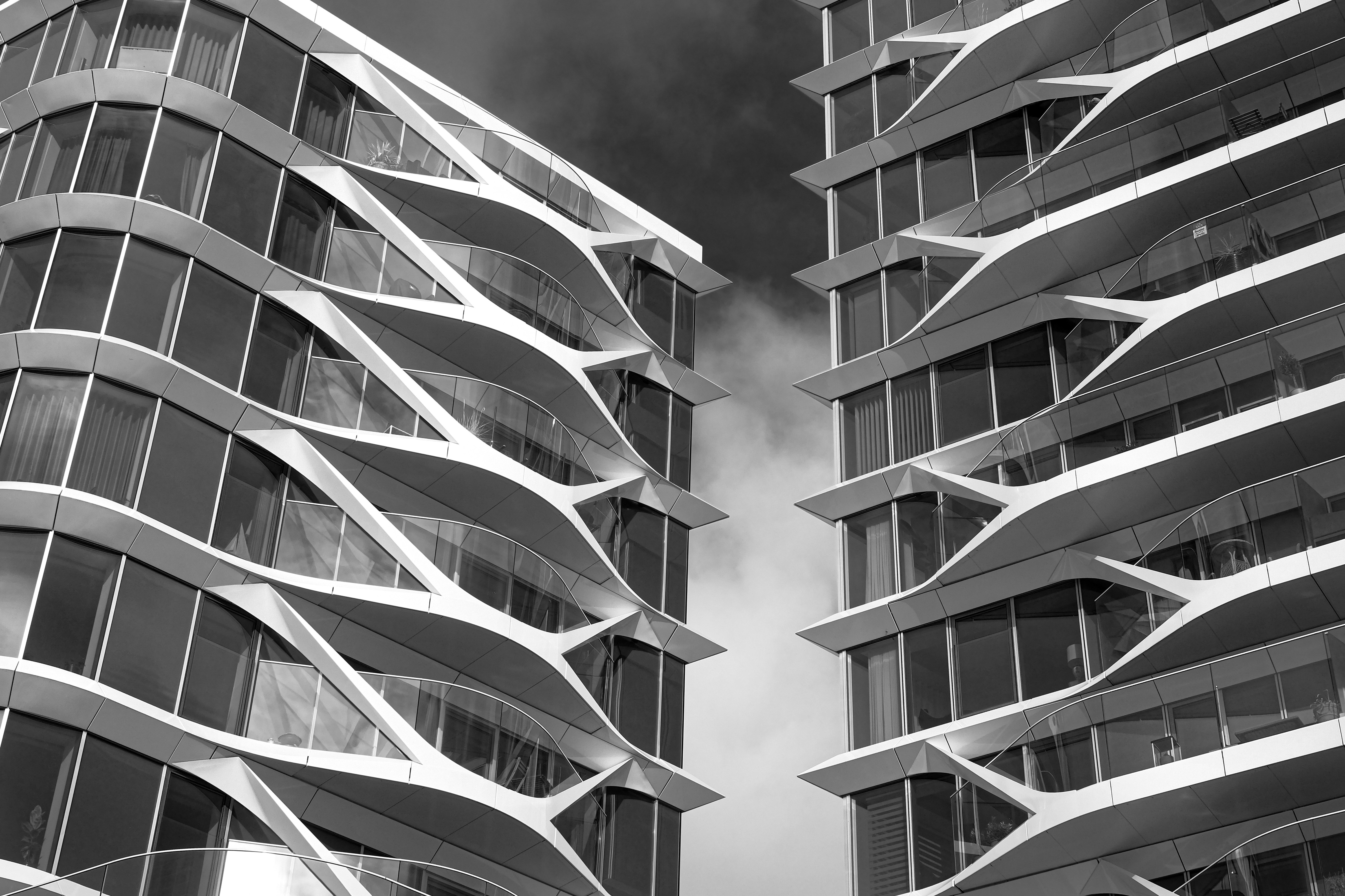 Twin Facades: Ribboned Architecture Converging Skyward