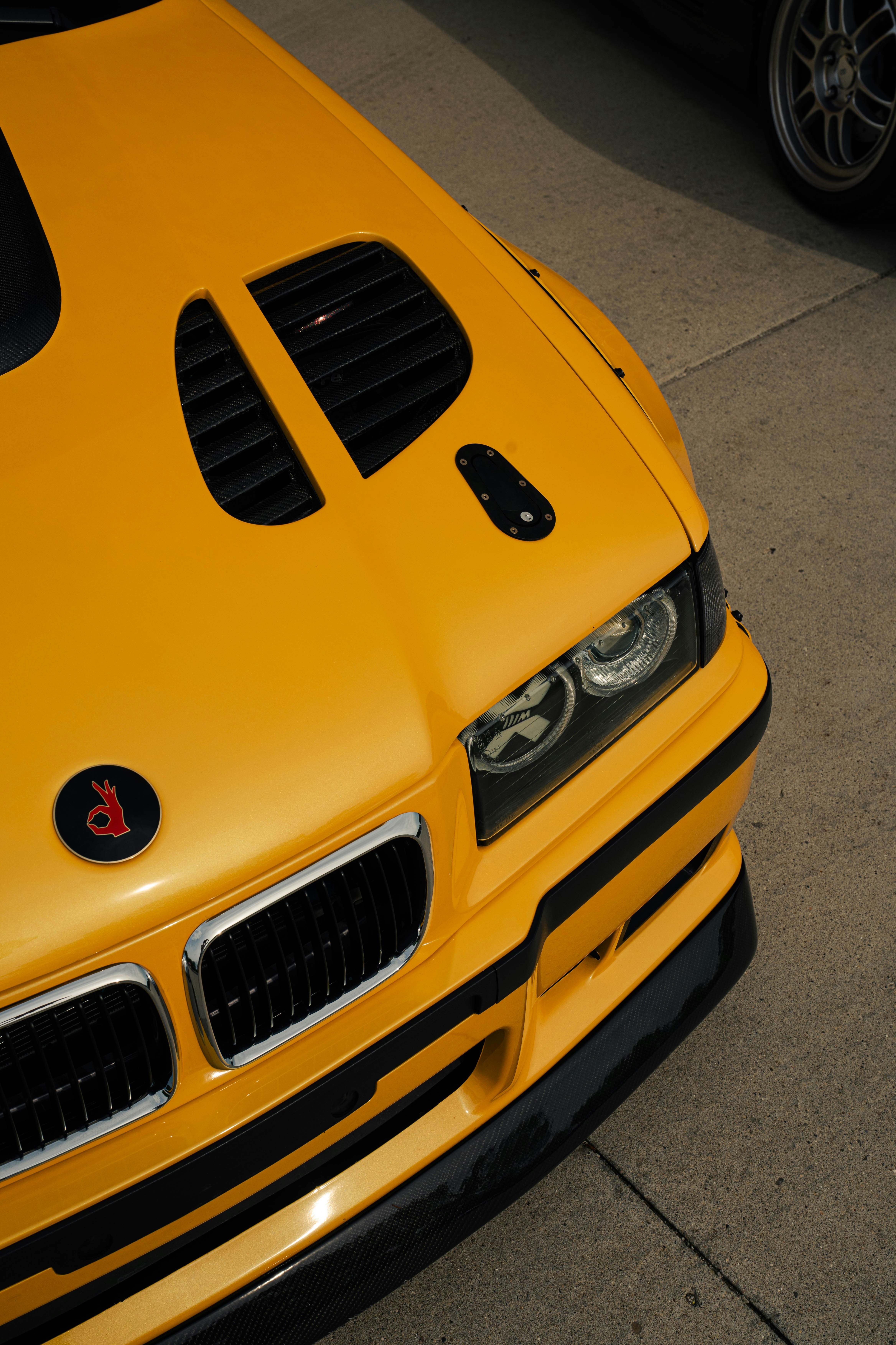 Yellow Power: A Bold Front View of a BMW-Style Street Racer