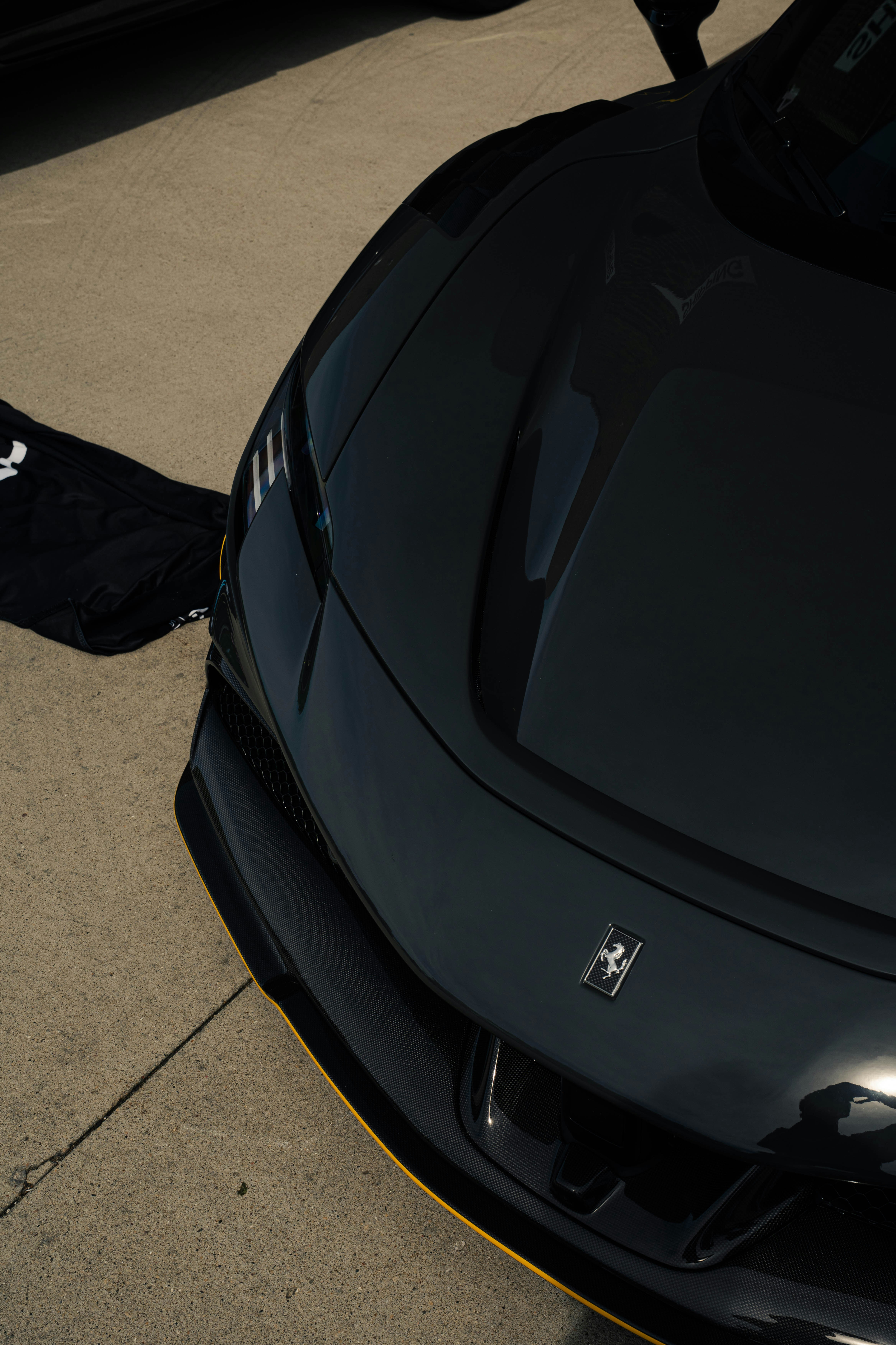 Dark satin contours: the Ferrari’s front close-up