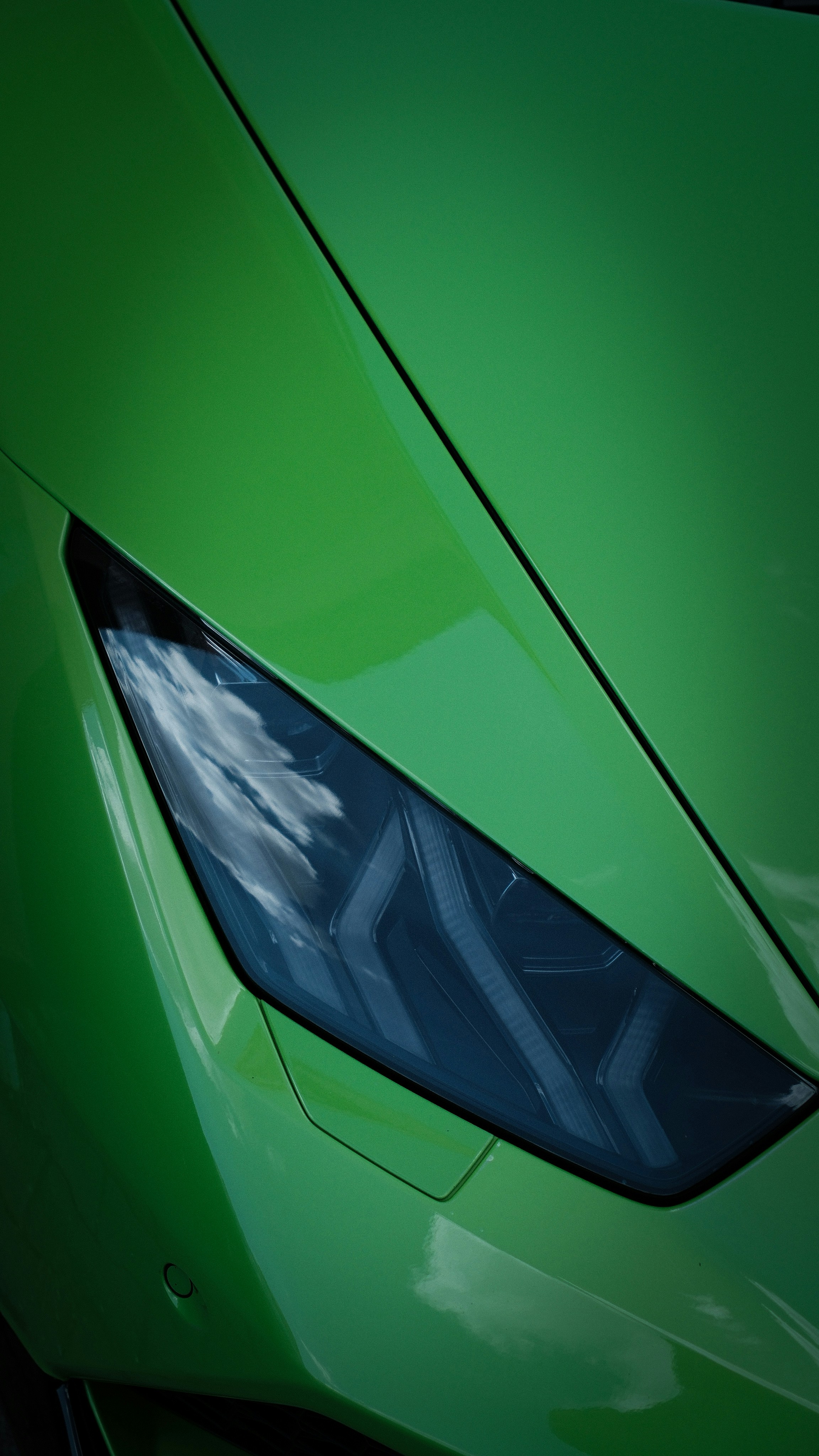 Green Velocity: A Close-Up of Bold Carheadlamp Lines