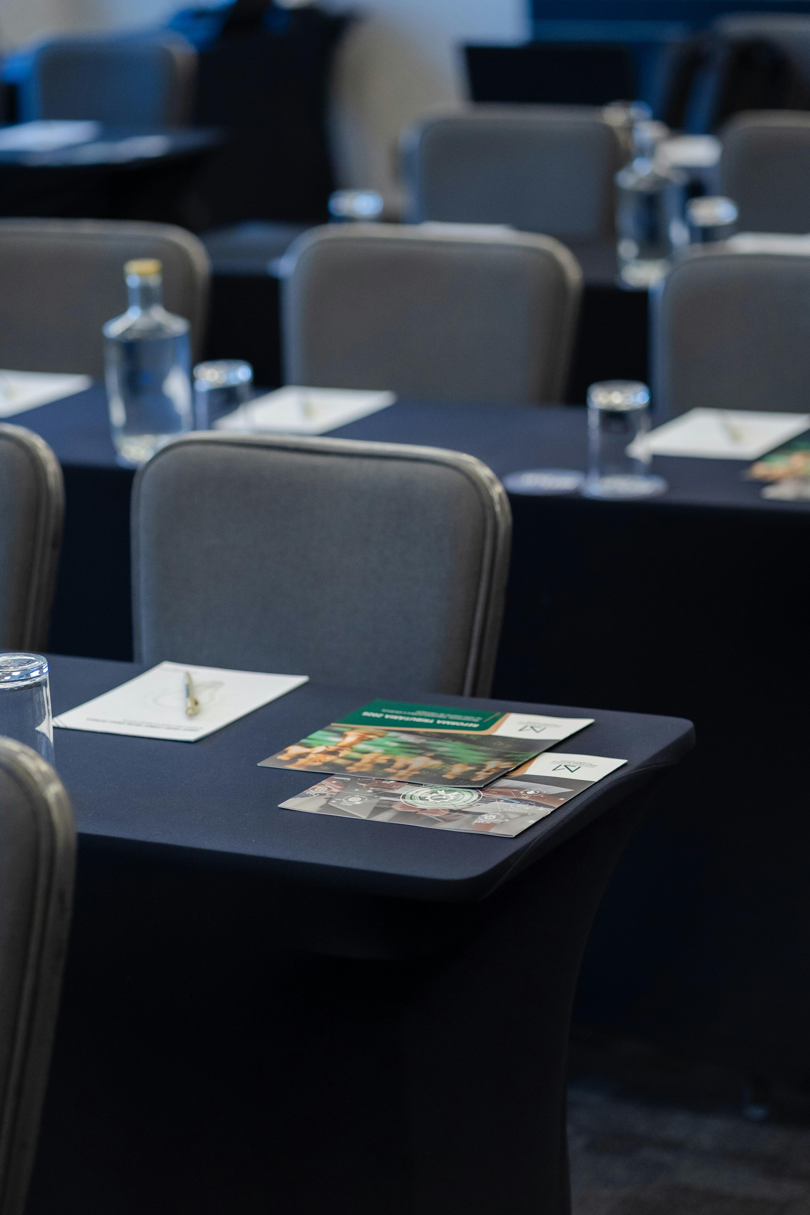 Quiet Conference Suite: Neatly Arranged Tables Ready for the Session