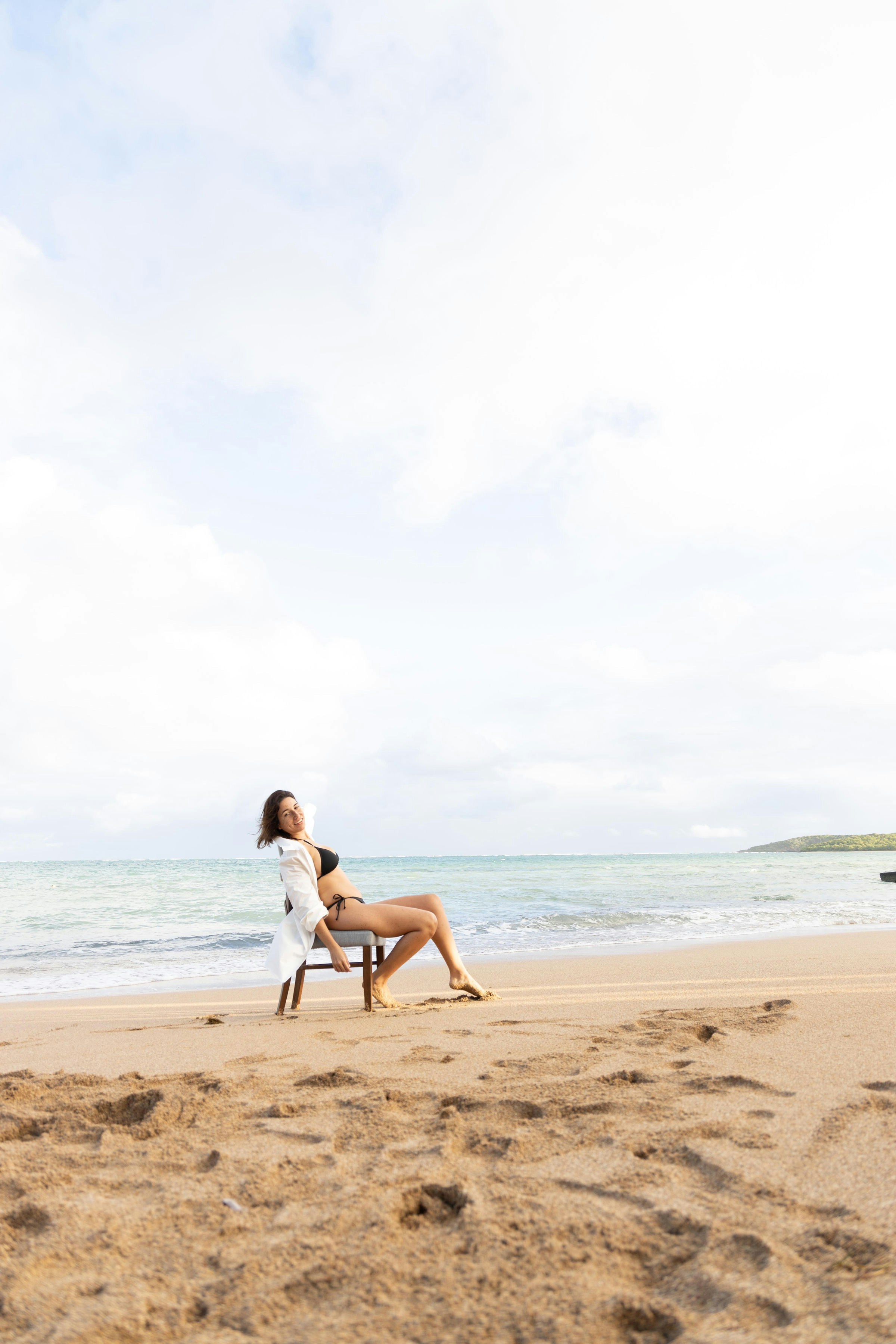 Beachside Confidence: a sunlit pose on a quiet shore