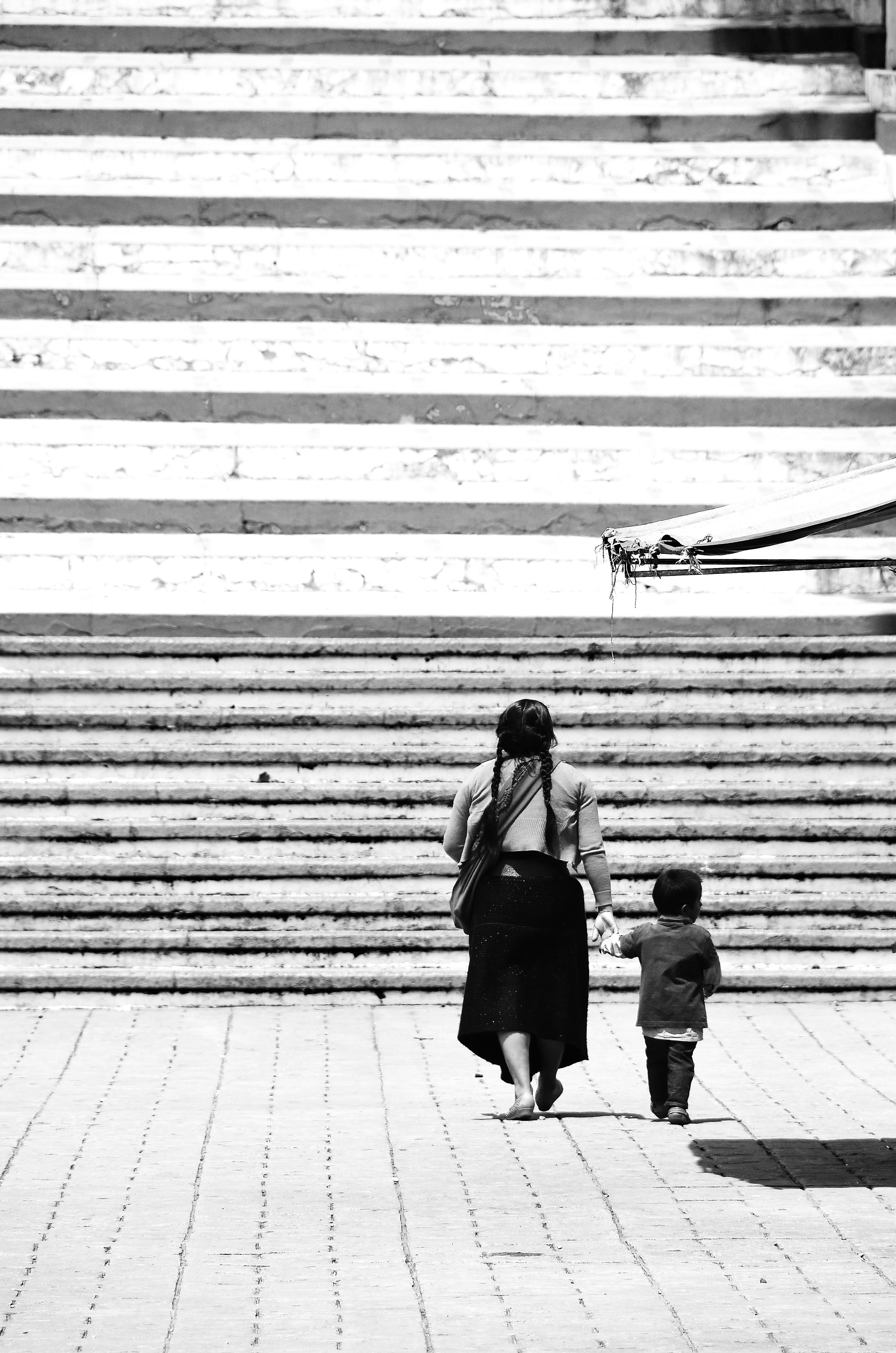 Steps of Memory: A Mother and Child Crossing into Light
