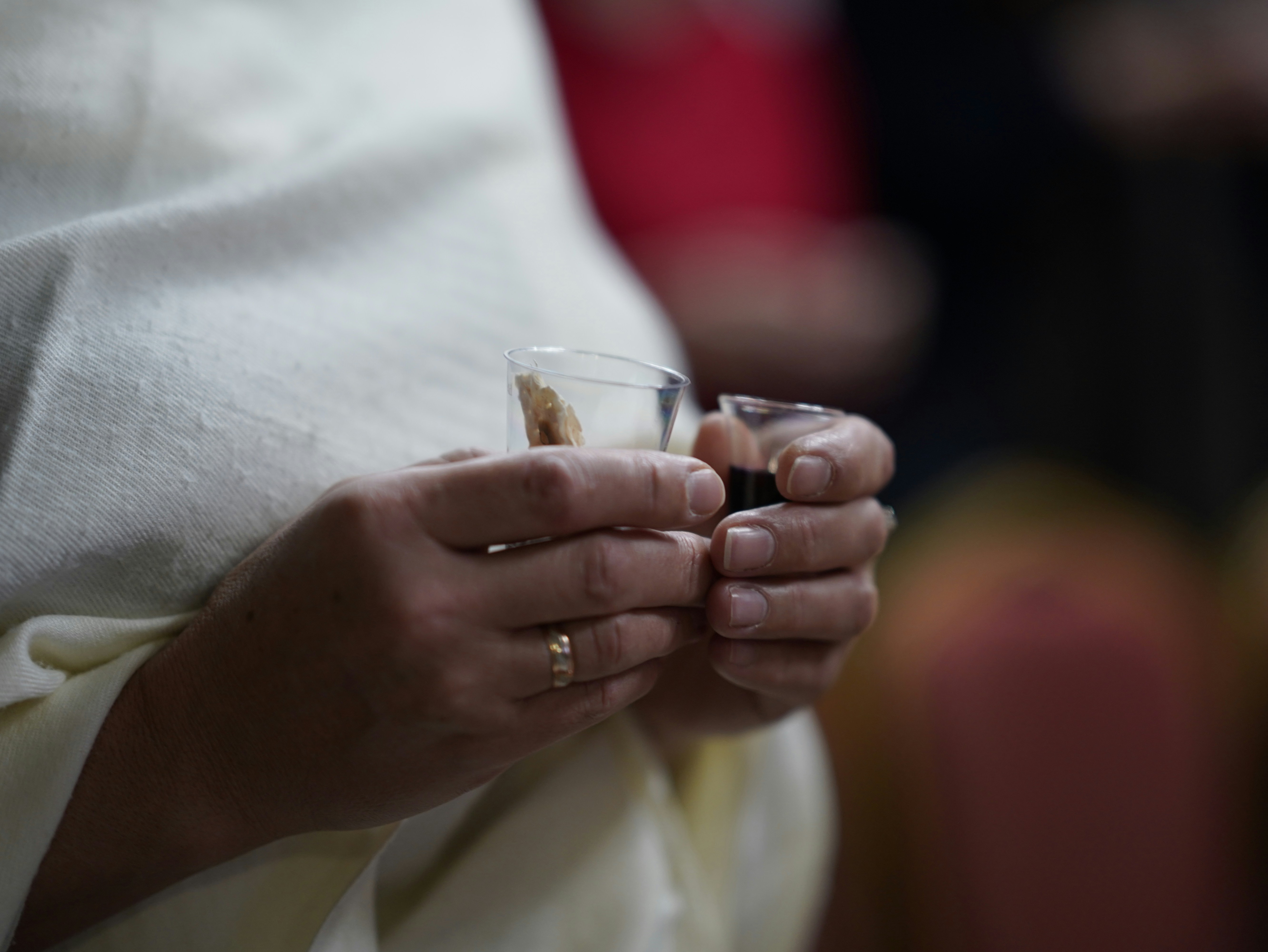 Holding small rituals: hands and glasses at a warm gathering